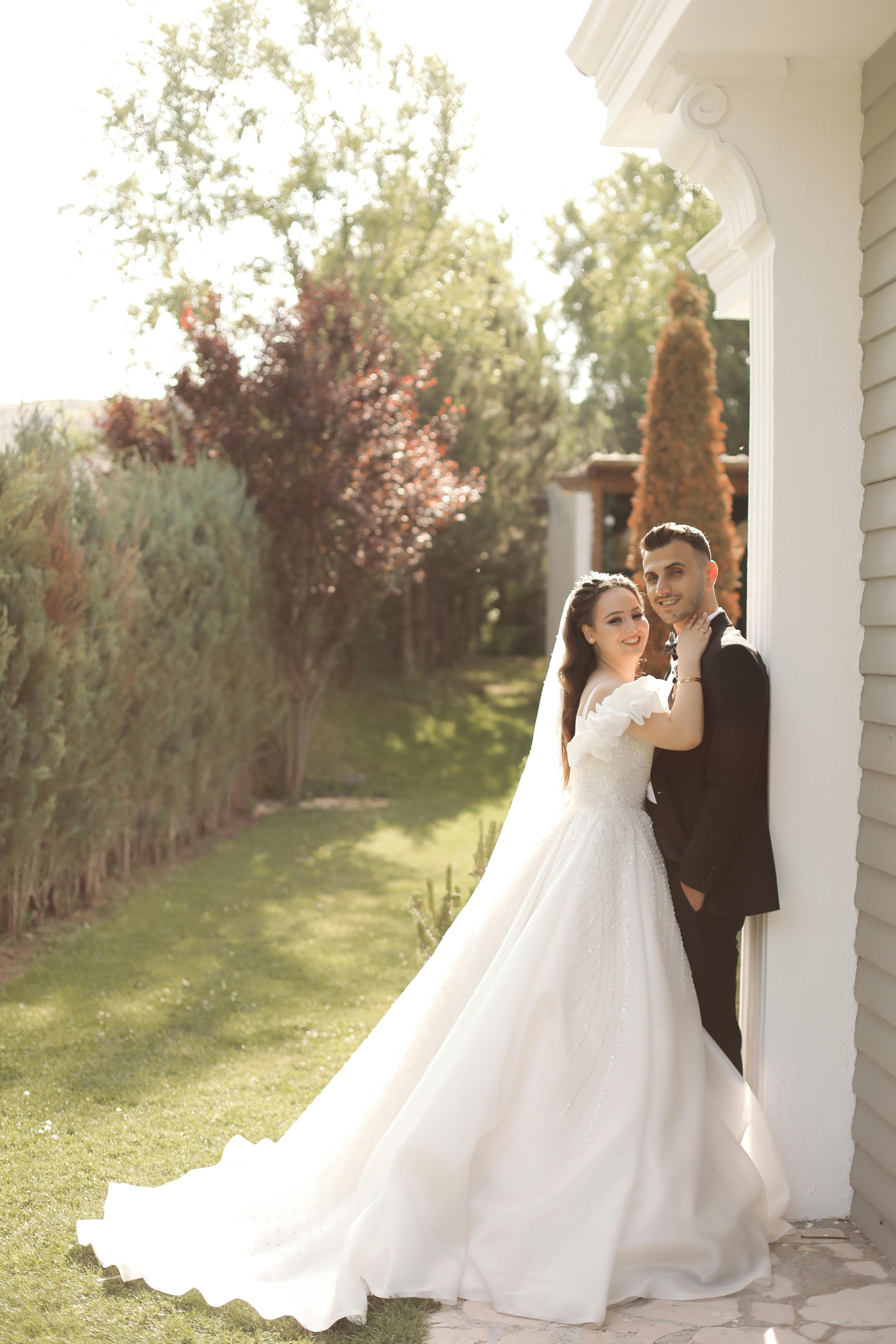Elegant Outdoor Wedding Portrait of Bride and Groom · Free Stock Photo