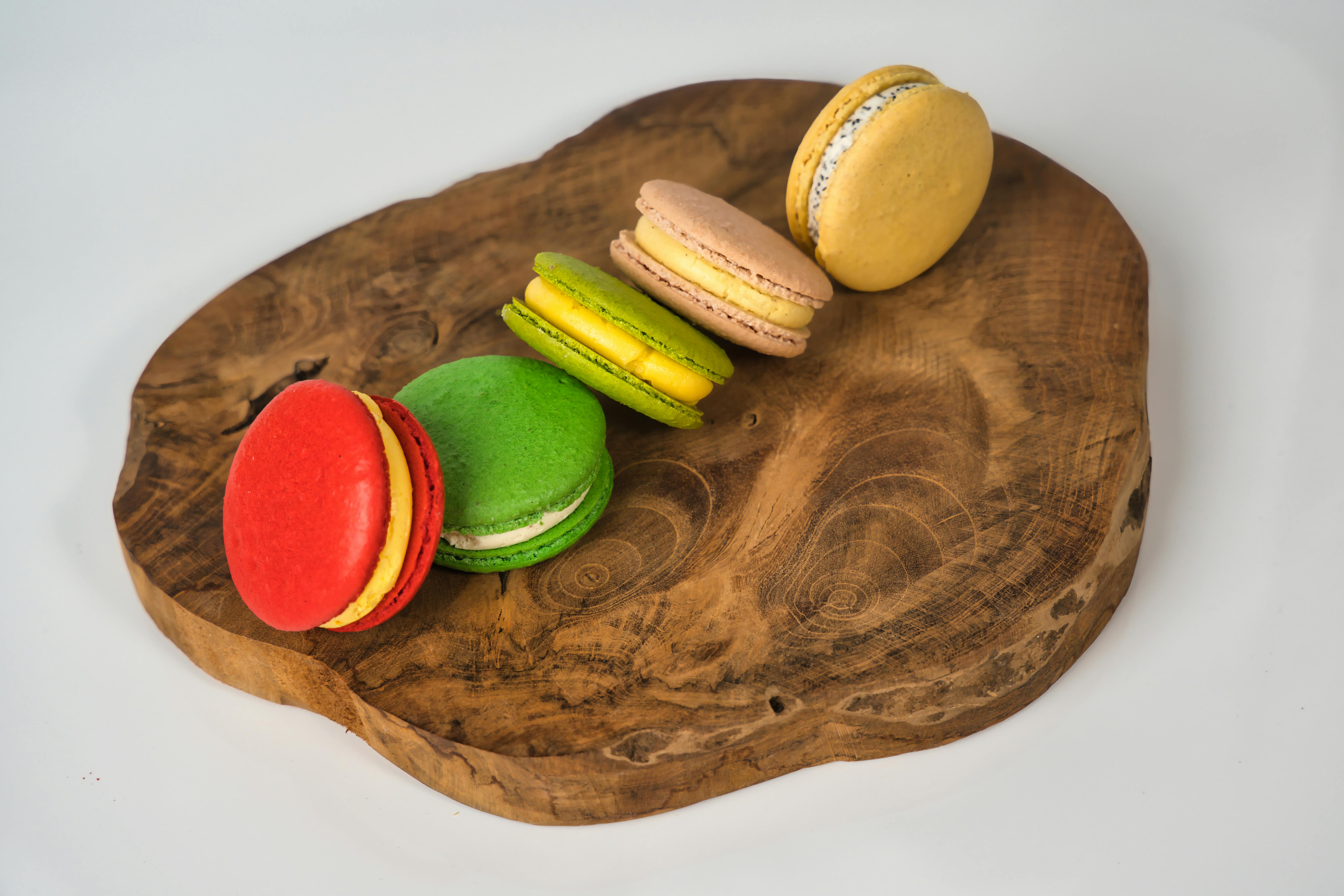 Colorful French Macarons on Wooden Platter · Free Stock Photo
