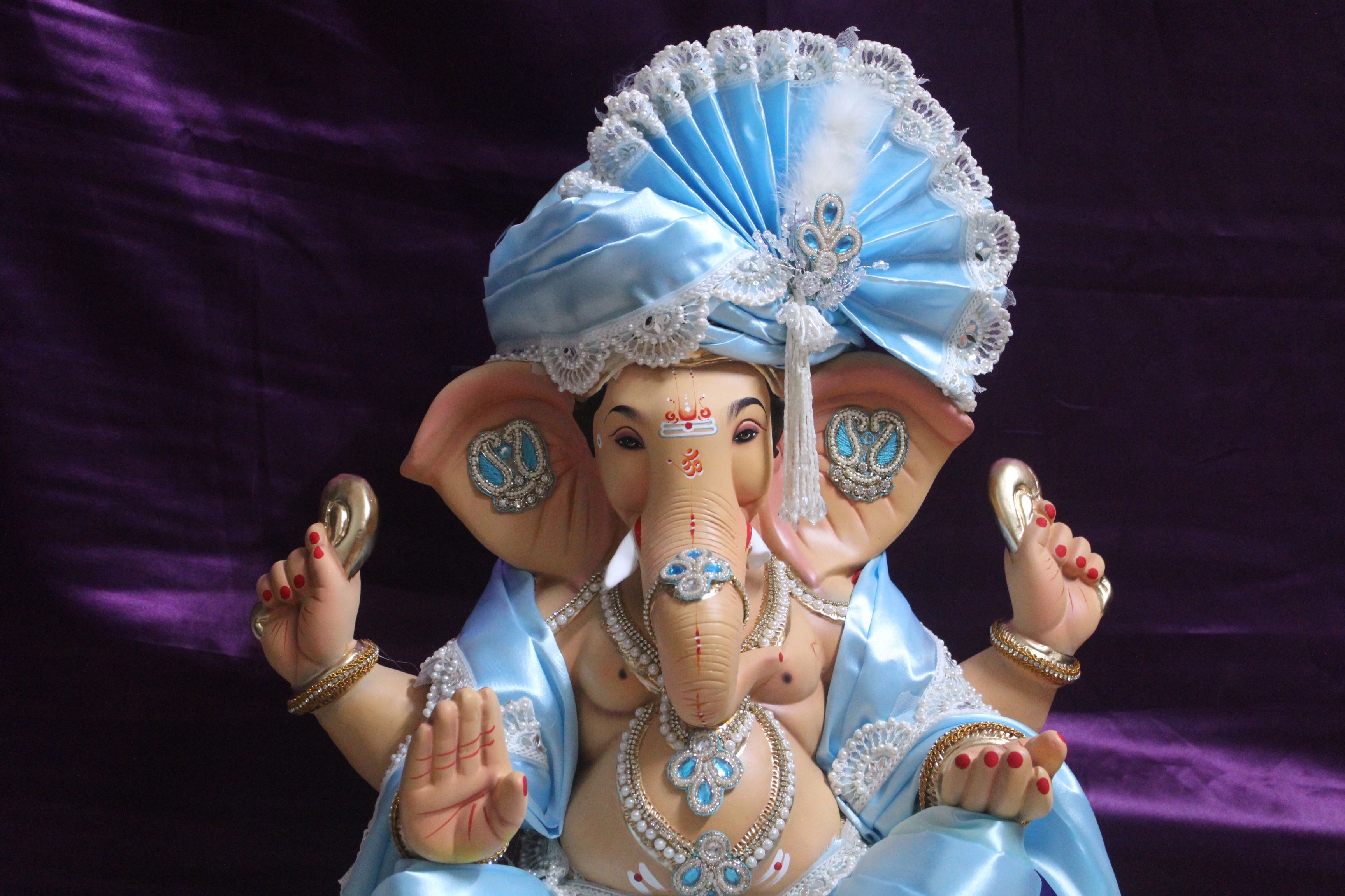 Elegant Lord Ganesha Idol with Blue Drapes · Free Stock Photo