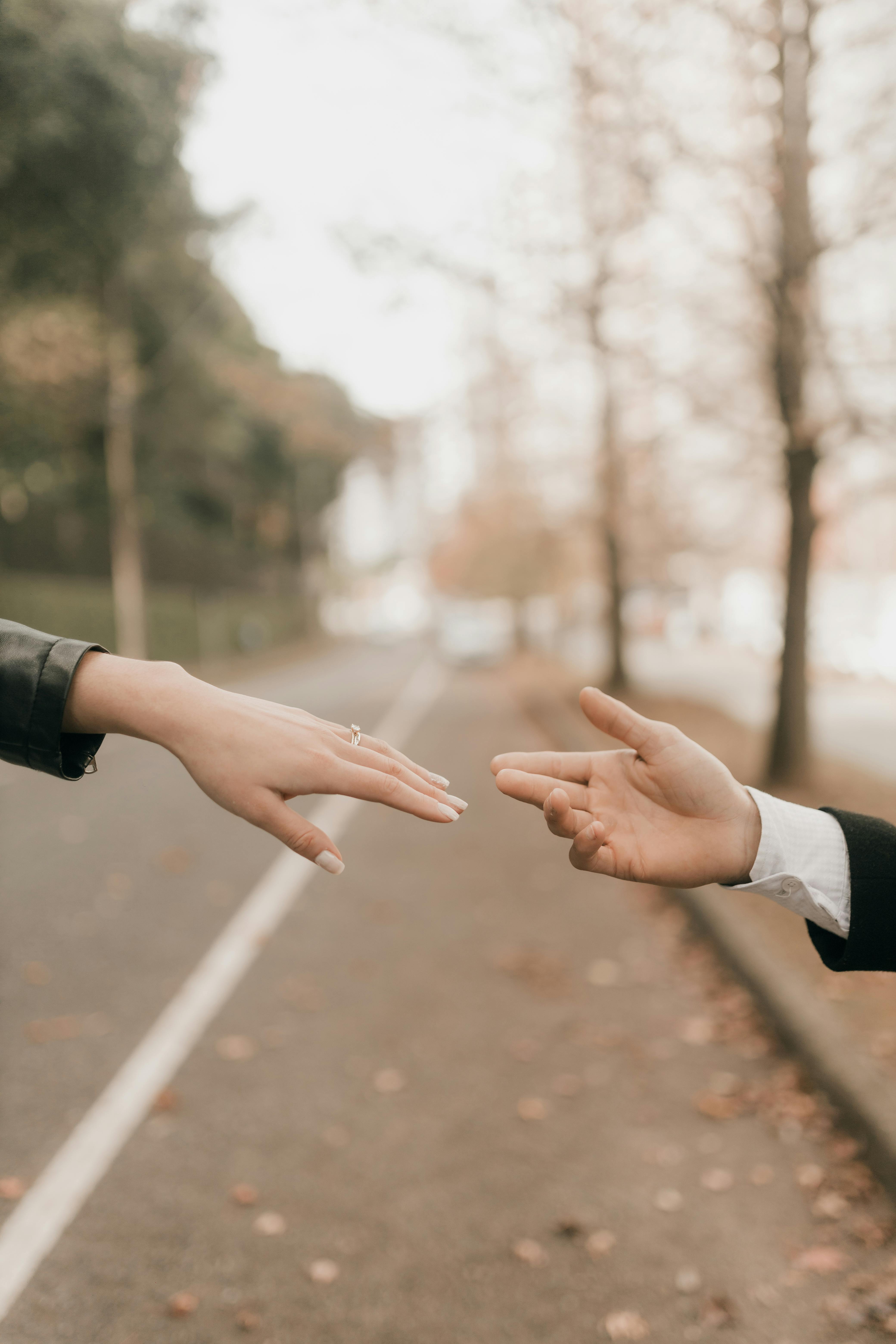 Romantic Hand Reach on Autumn Street · Free Stock Photo