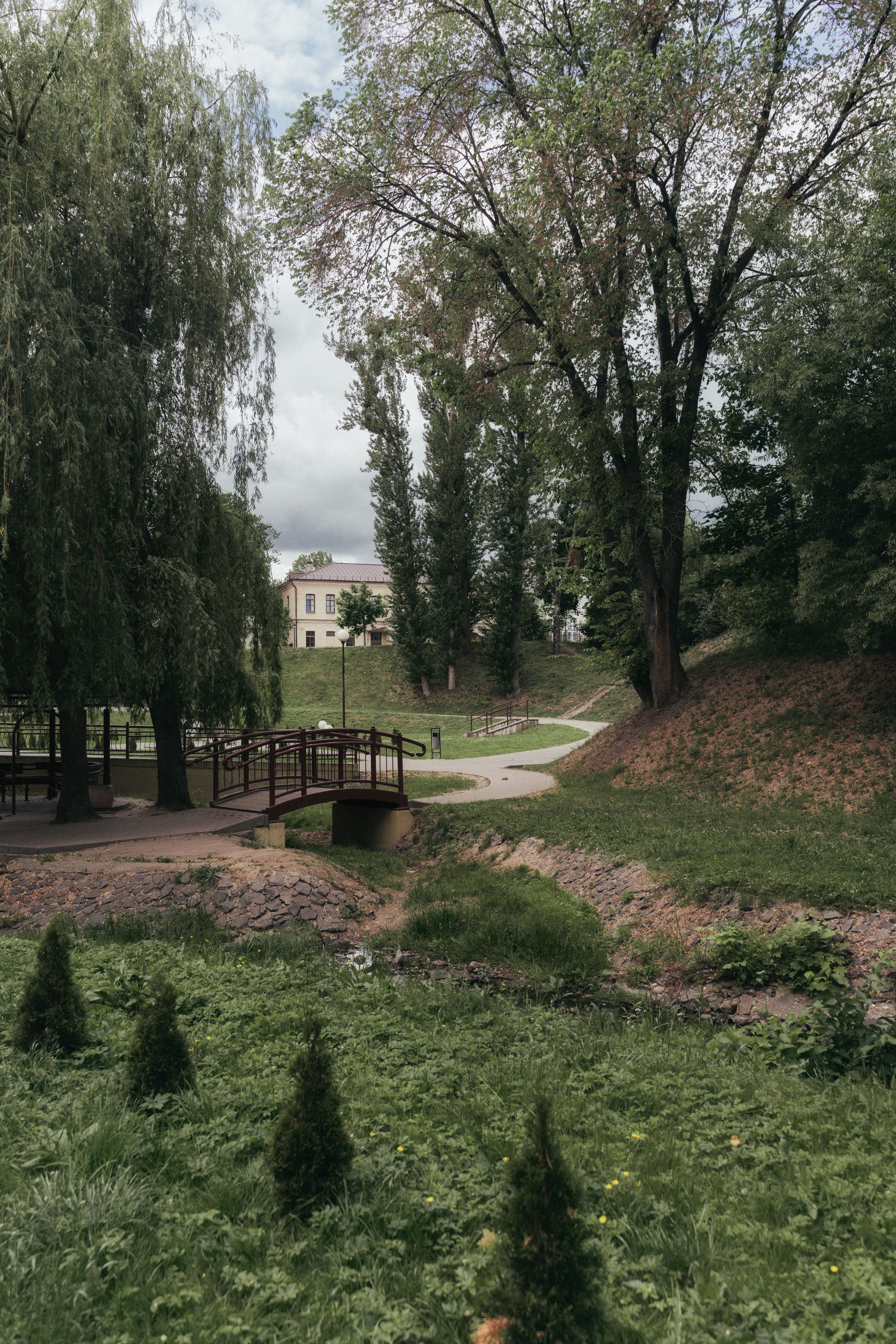 Serene Park Scene with Bridge and Trees · Free Stock Photo