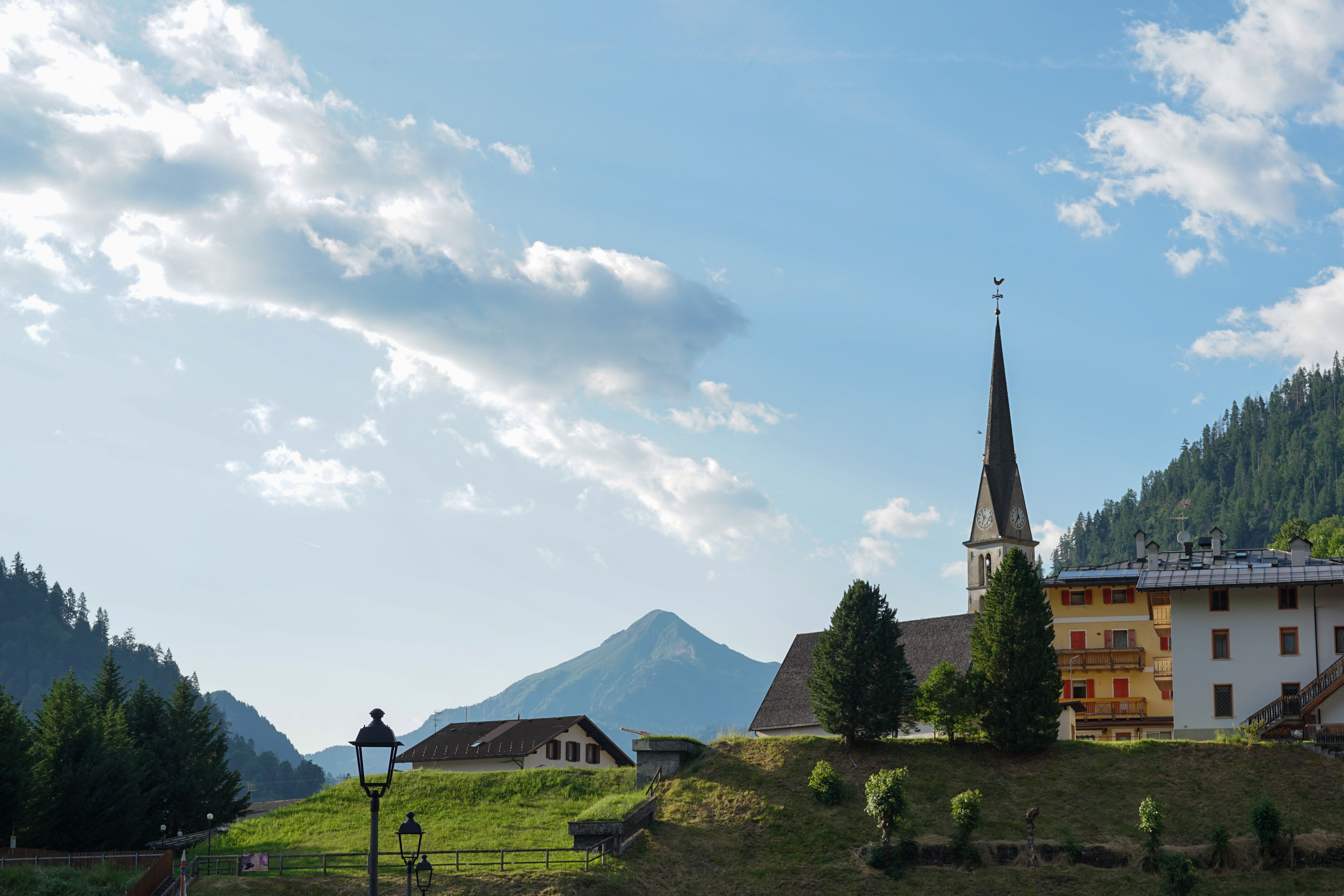 Picturesque Alpine Village with Church Spire · Free Stock Photo