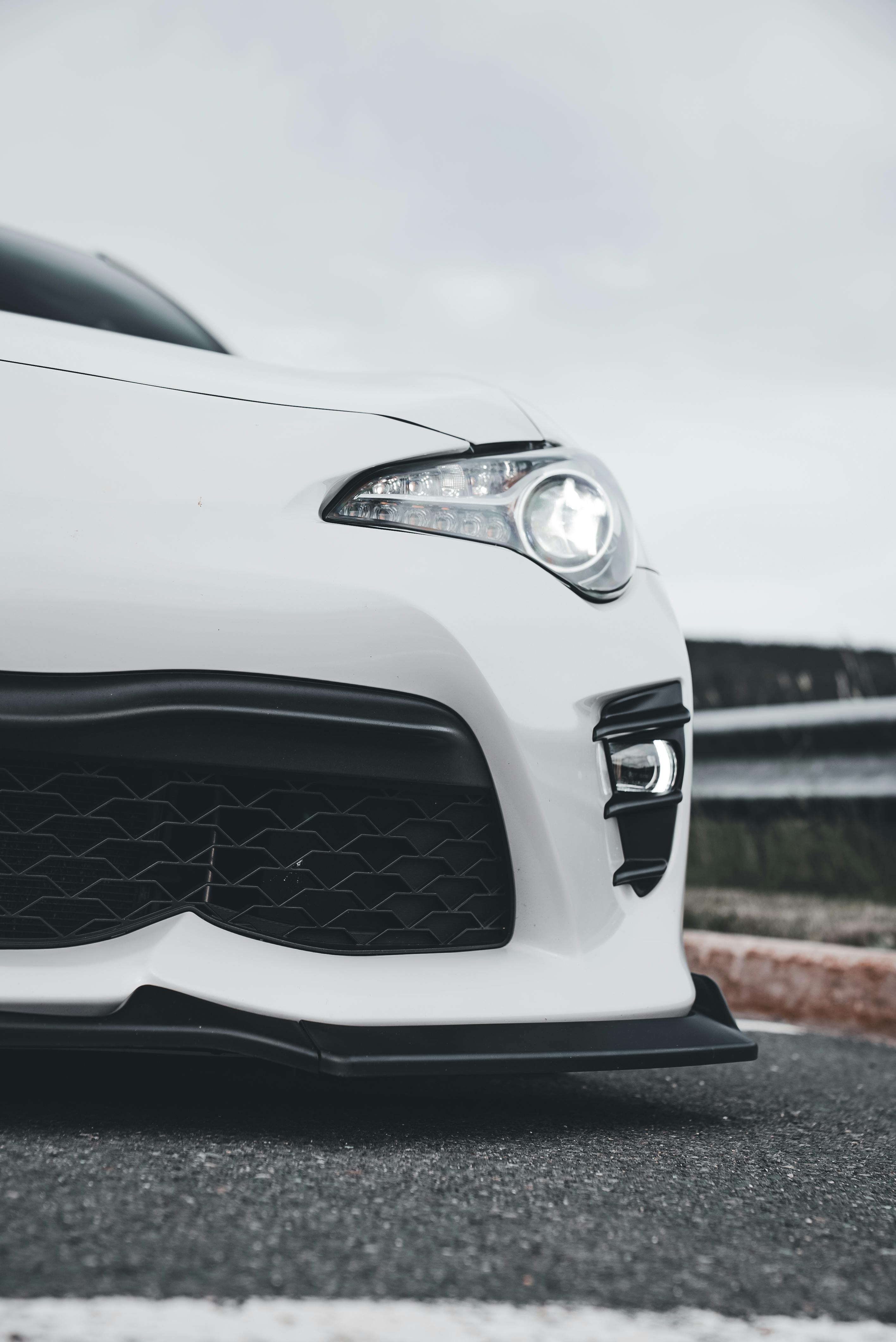 Close-Up of a Modern Sports Car Front Bumper · Free Stock Photo