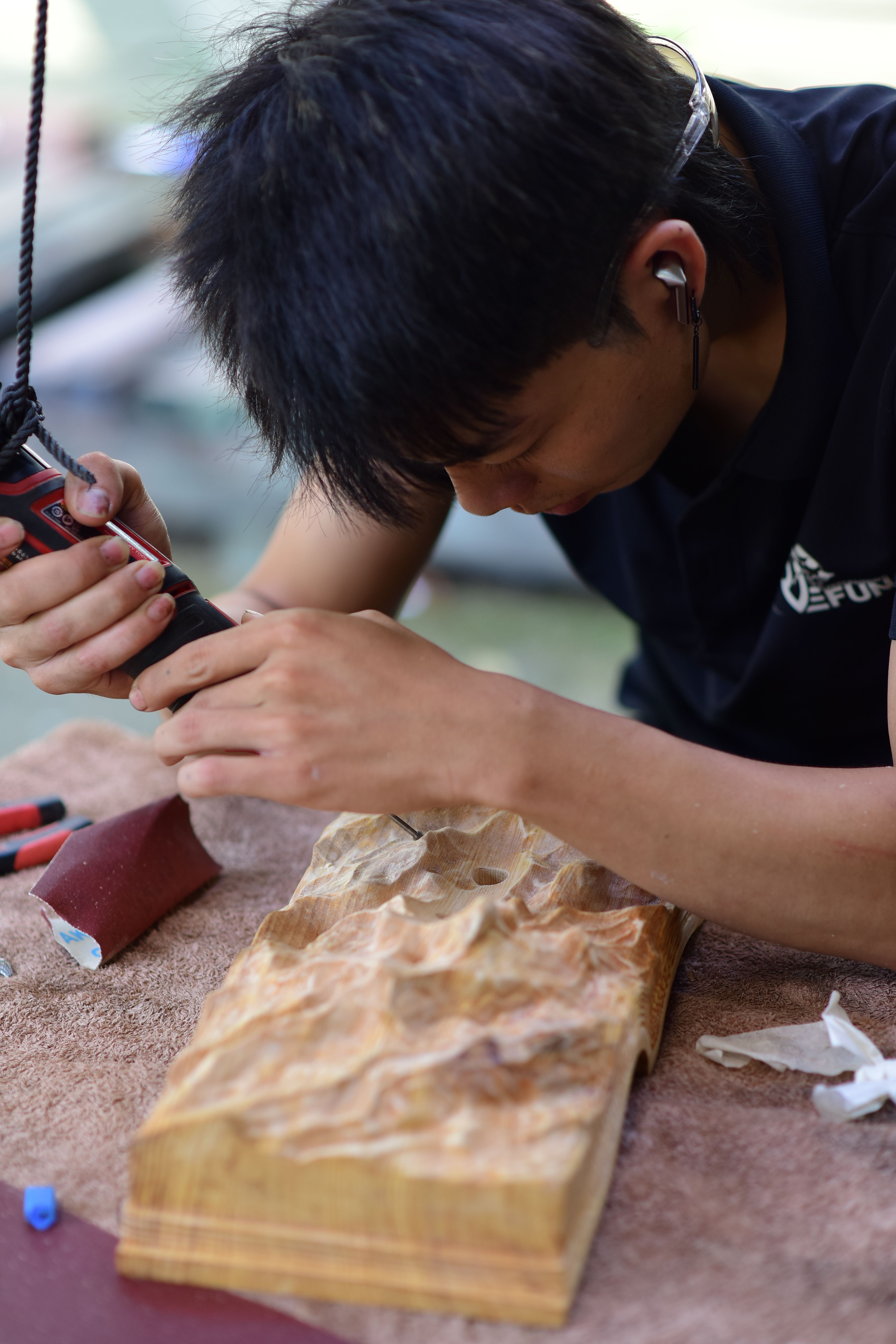 Focused Wood Carver Creating Intricate Designs · Free Stock Photo
