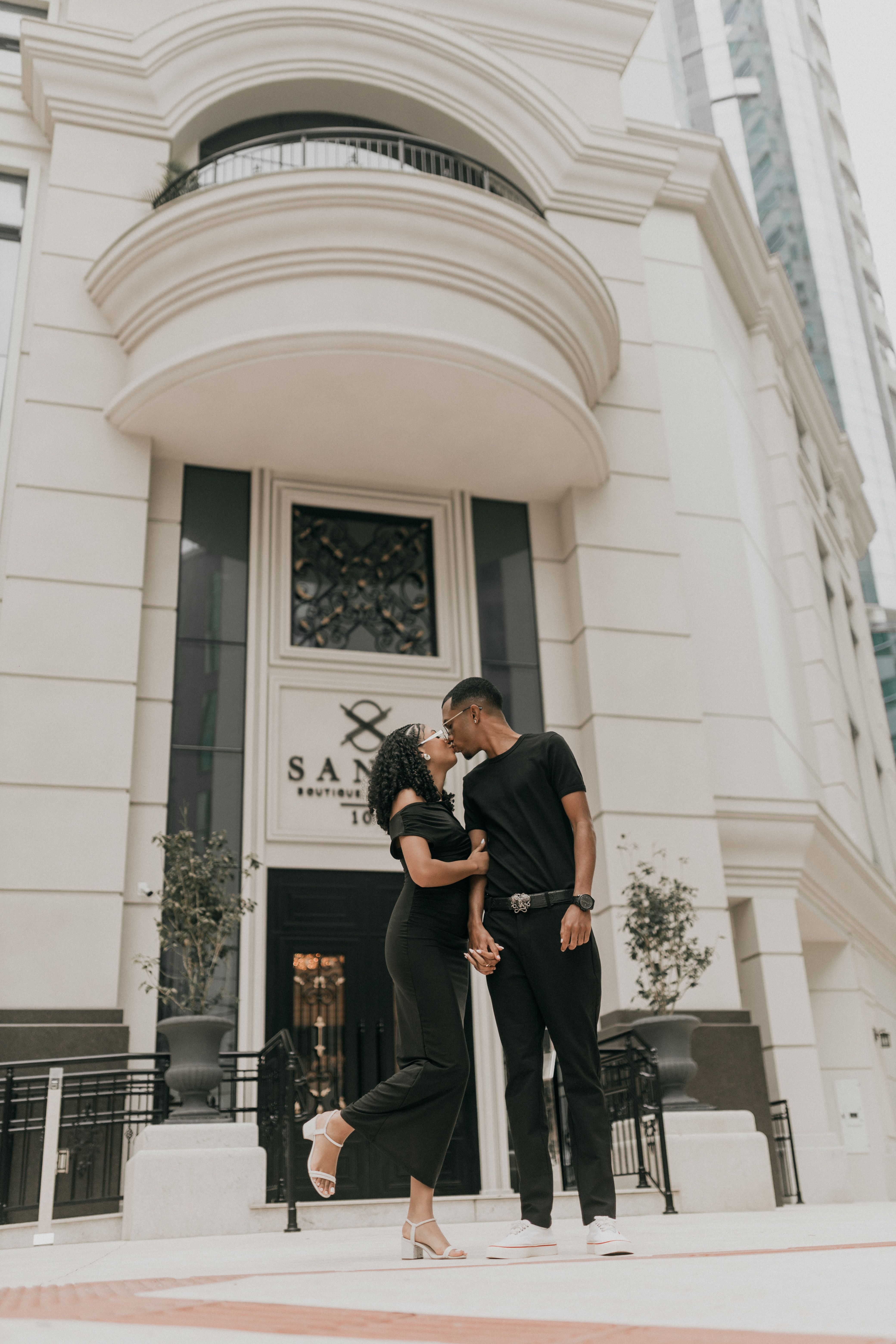 Romantic Couple Posing Outside Elegant Building · Free Stock Photo