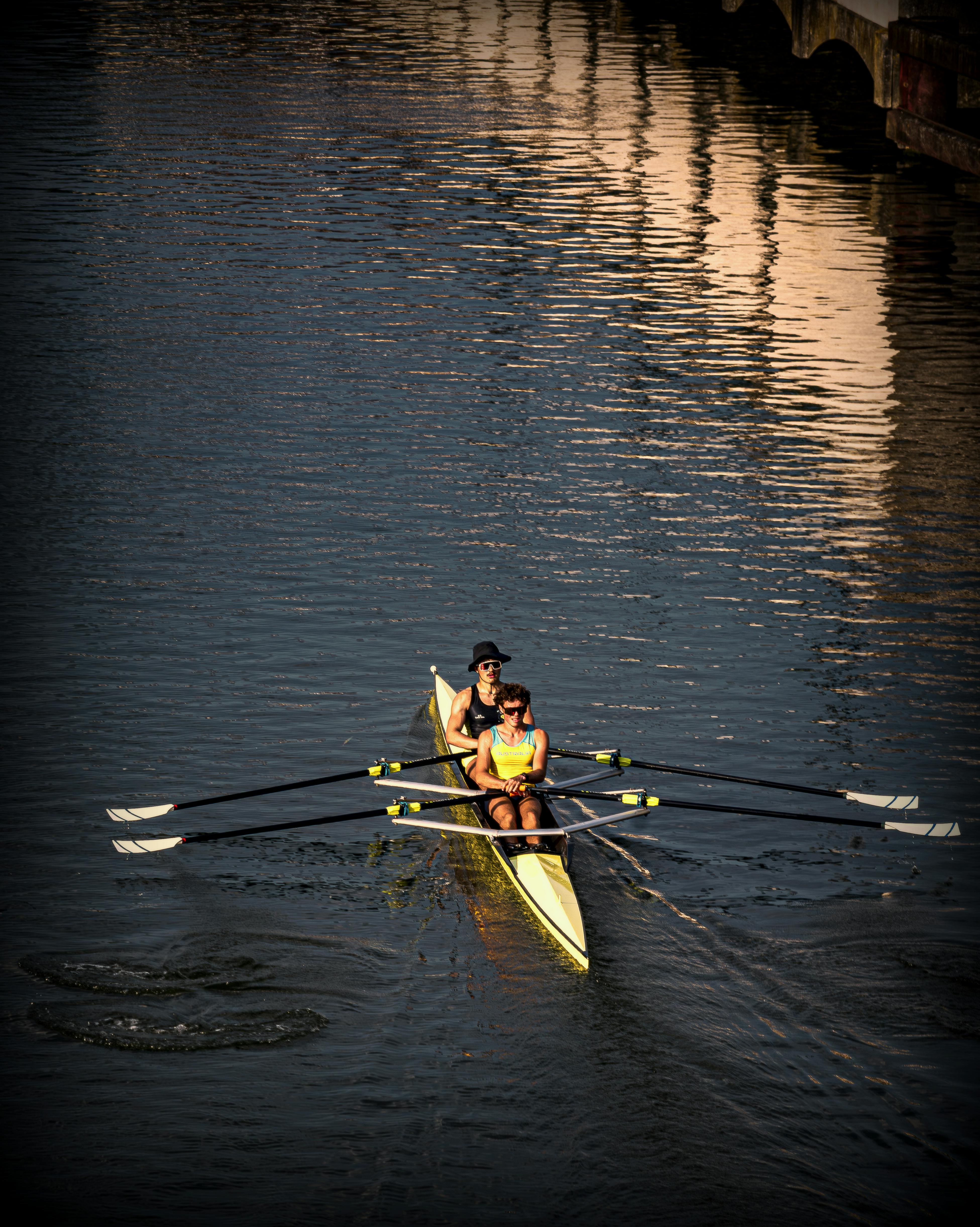 Serene Rowing at Sunset on Tranquil River · Free Stock Photo
