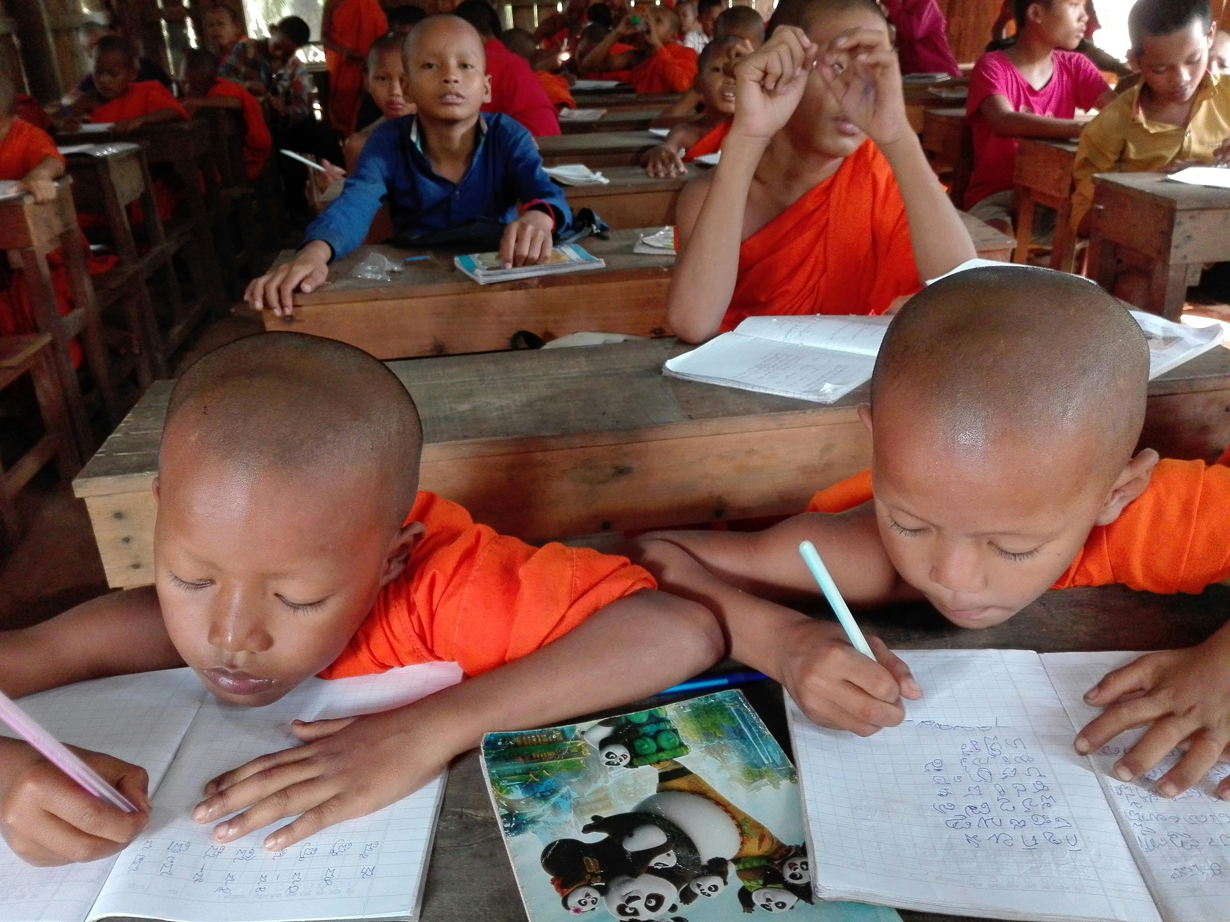 Young Buddhist Monks Learning in Cambodian Classroom · Free Stock Photo