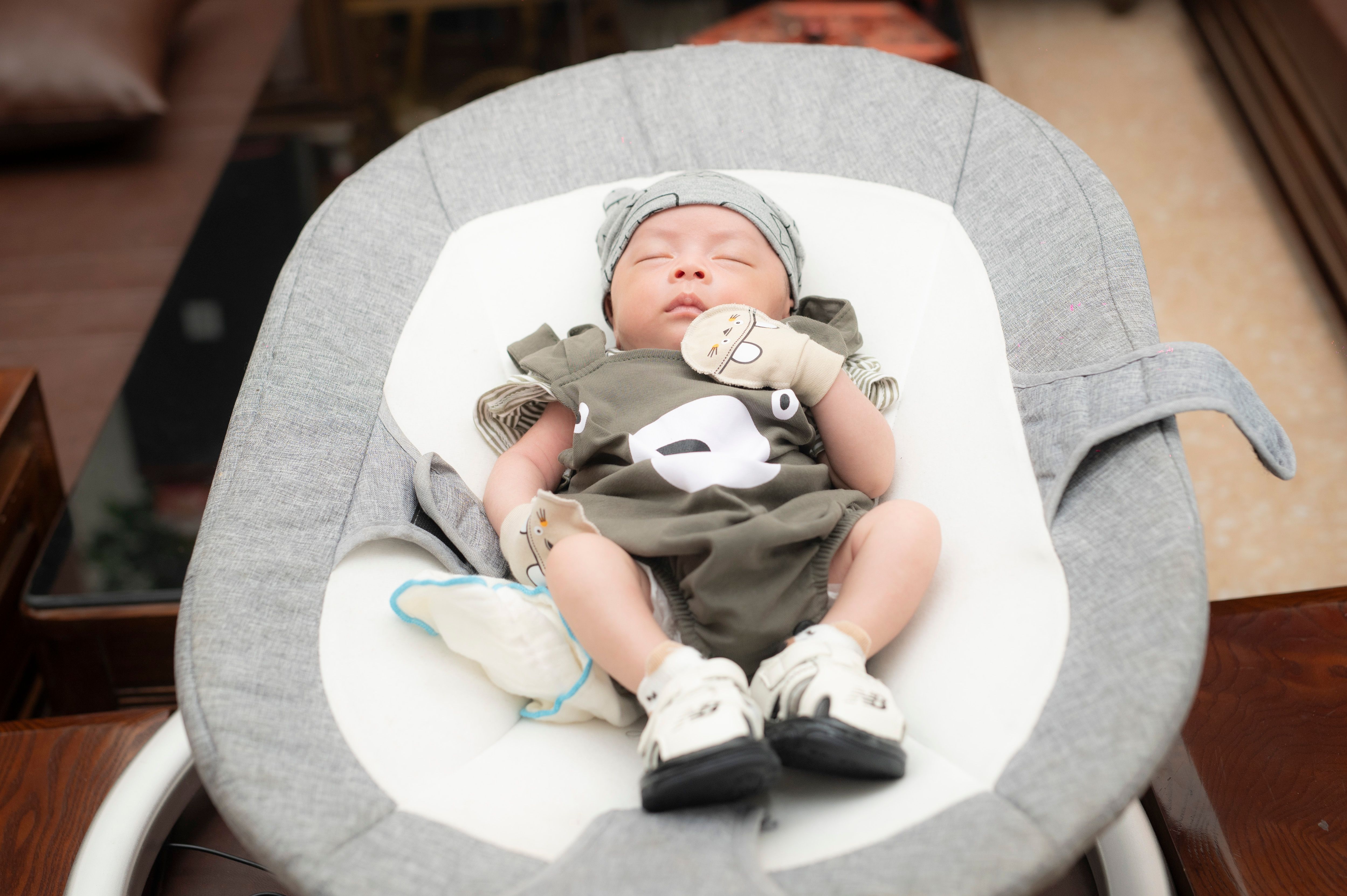 Sleeping Baby in Cradle with Cute Outfit · Free Stock Photo