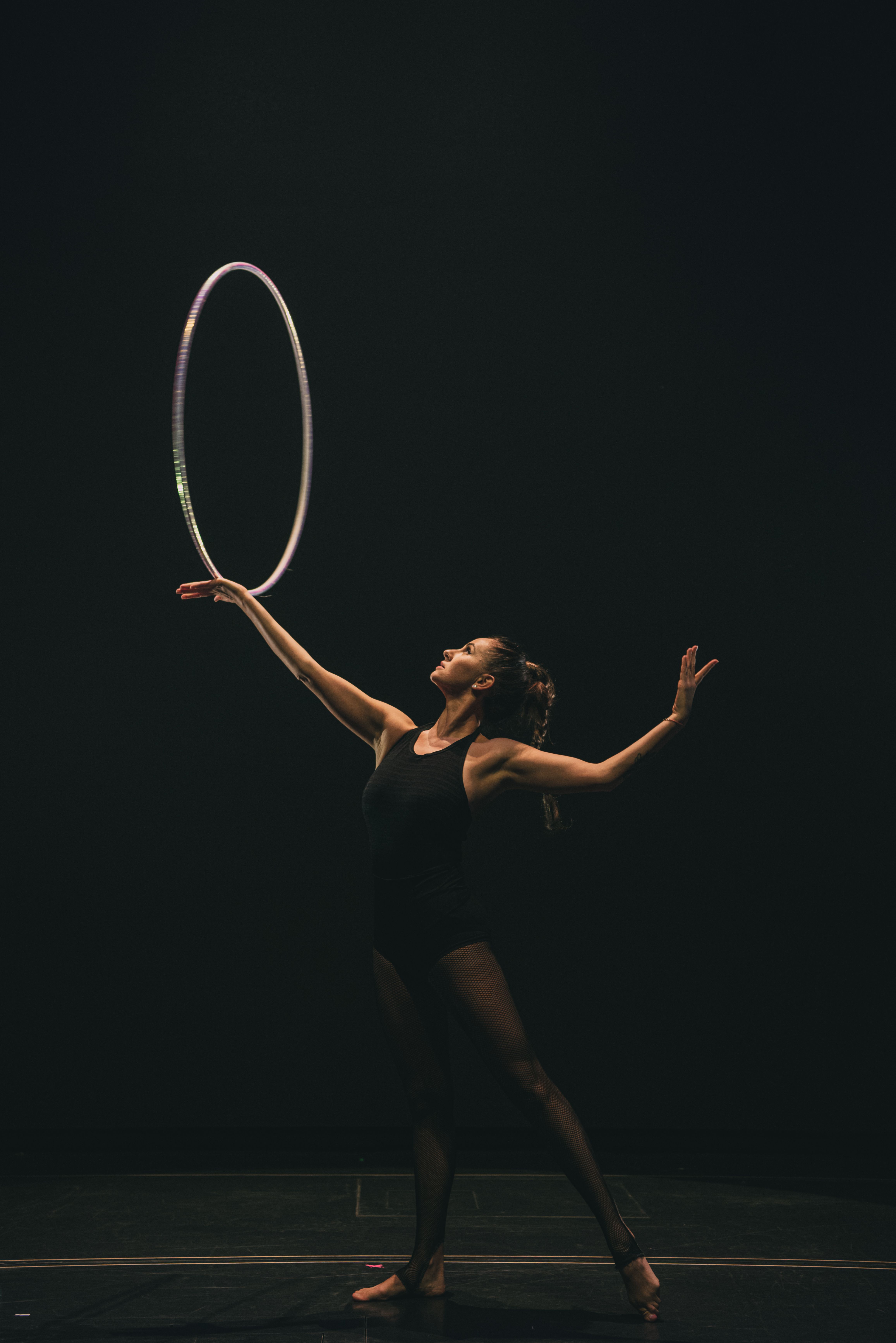 Graceful Dancer with Hoop on Stage · Free Stock Photo