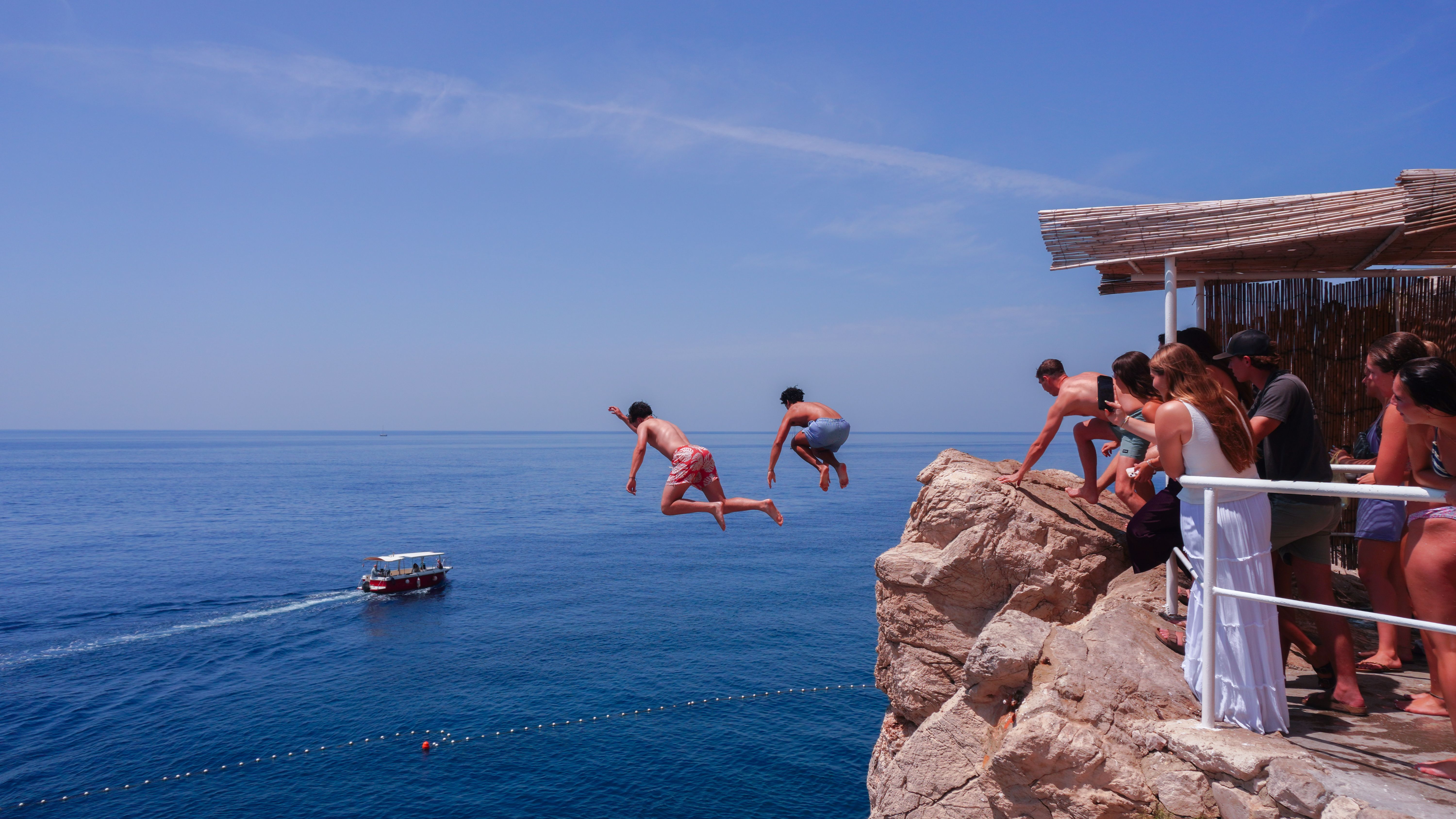 Thrilling Cliff Jumping in Dubrovnik · Free Stock Photo