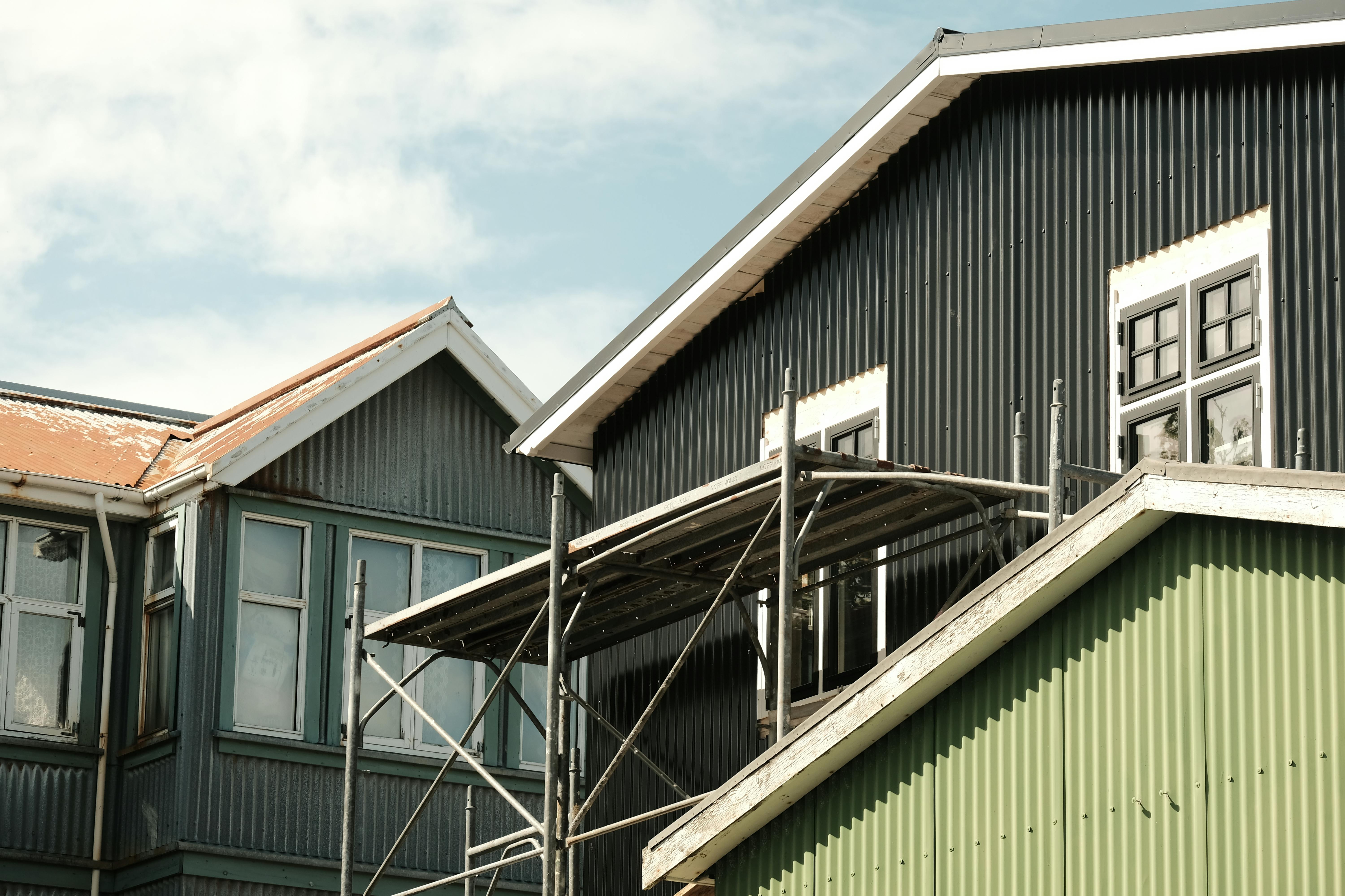 Wooden House Gable Under Clear Blue Sky · Free Stock Photo