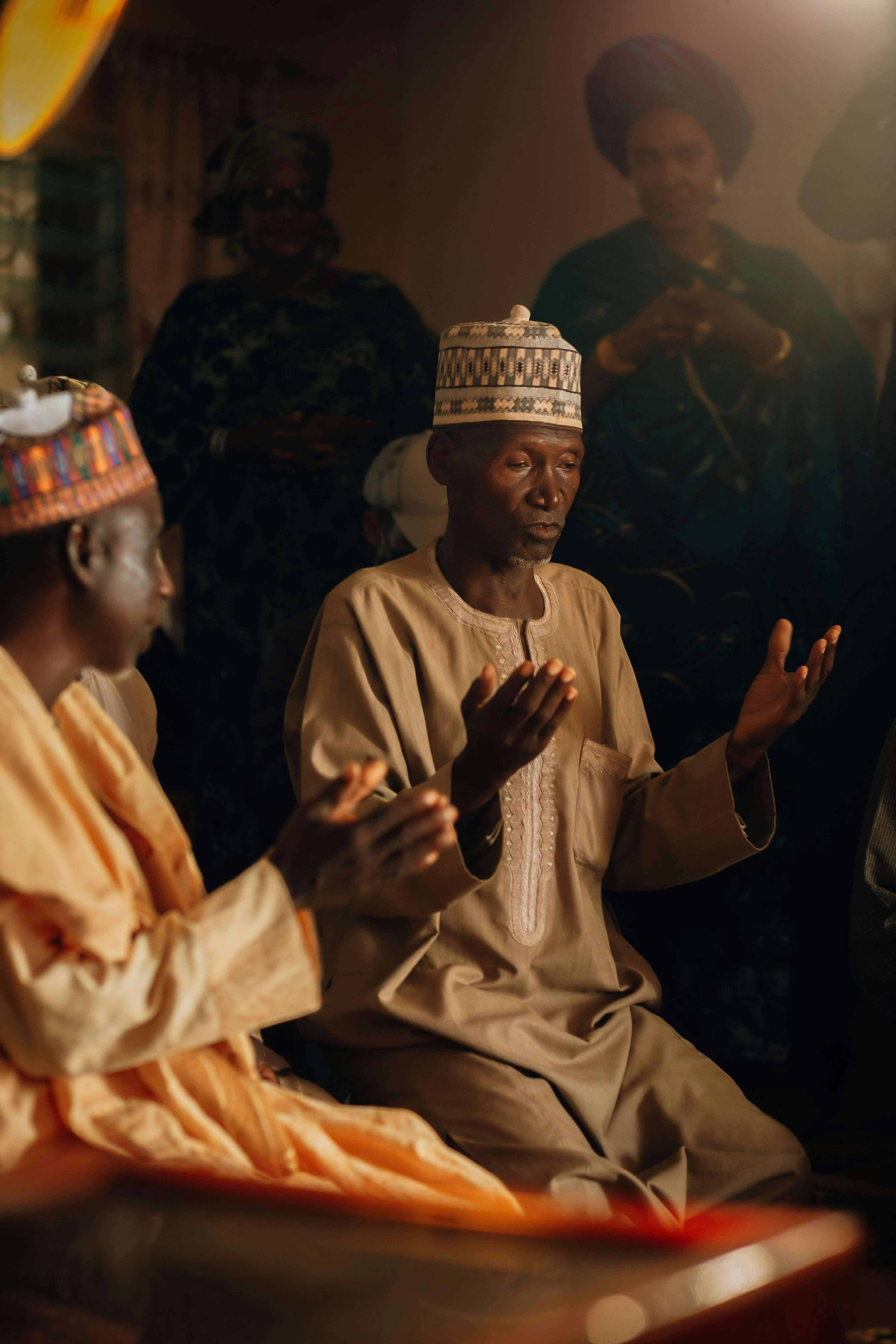 Traditional Cultural Gathering with Men Praying · Free Stock Photo