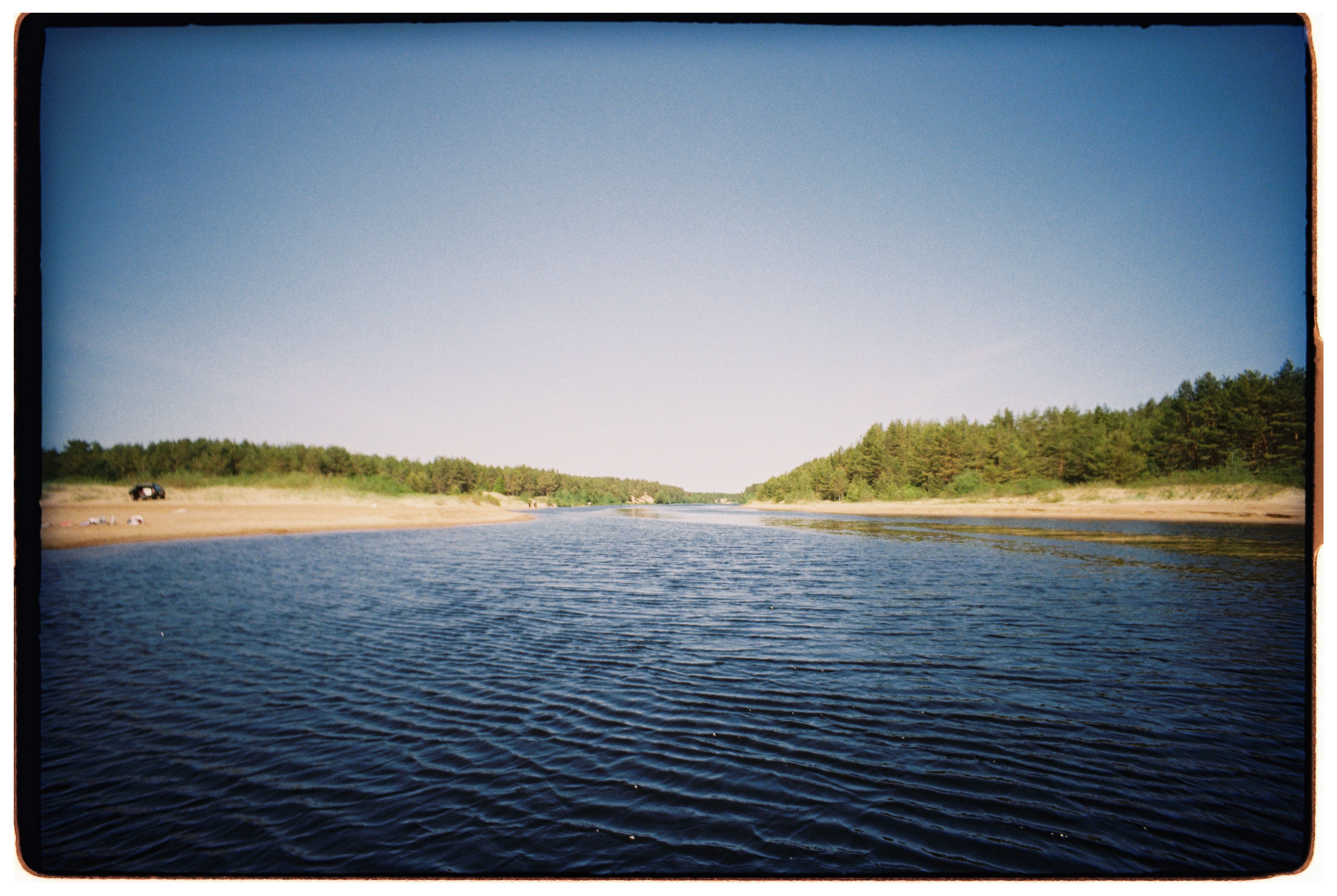Tranquil River Landscape under Blue Sky · Free Stock Photo