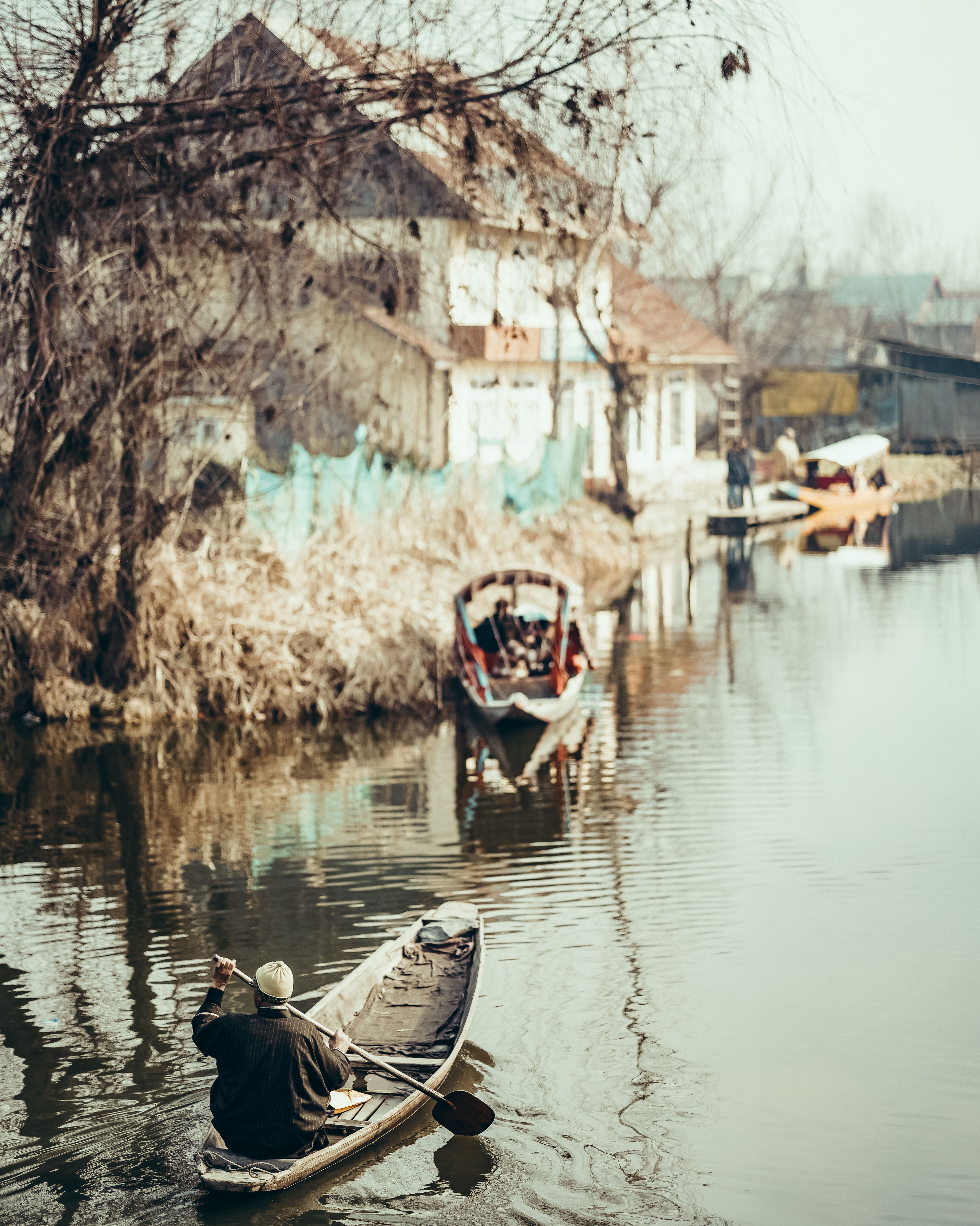 Scenic River Journey in Quaint Village Setting · Free Stock Photo