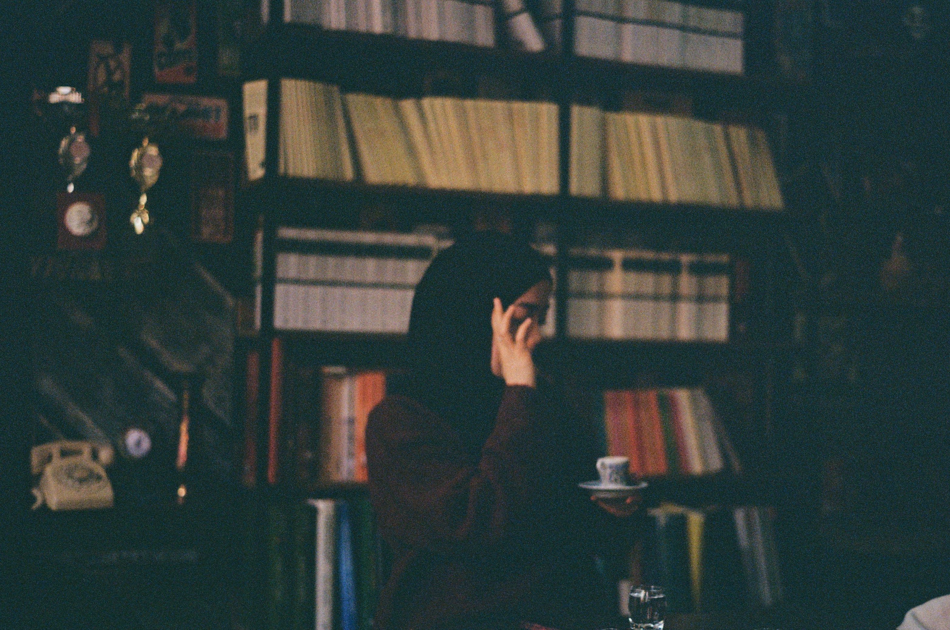 Cozy Library Moment with Coffee and Conversation · Free Stock Photo