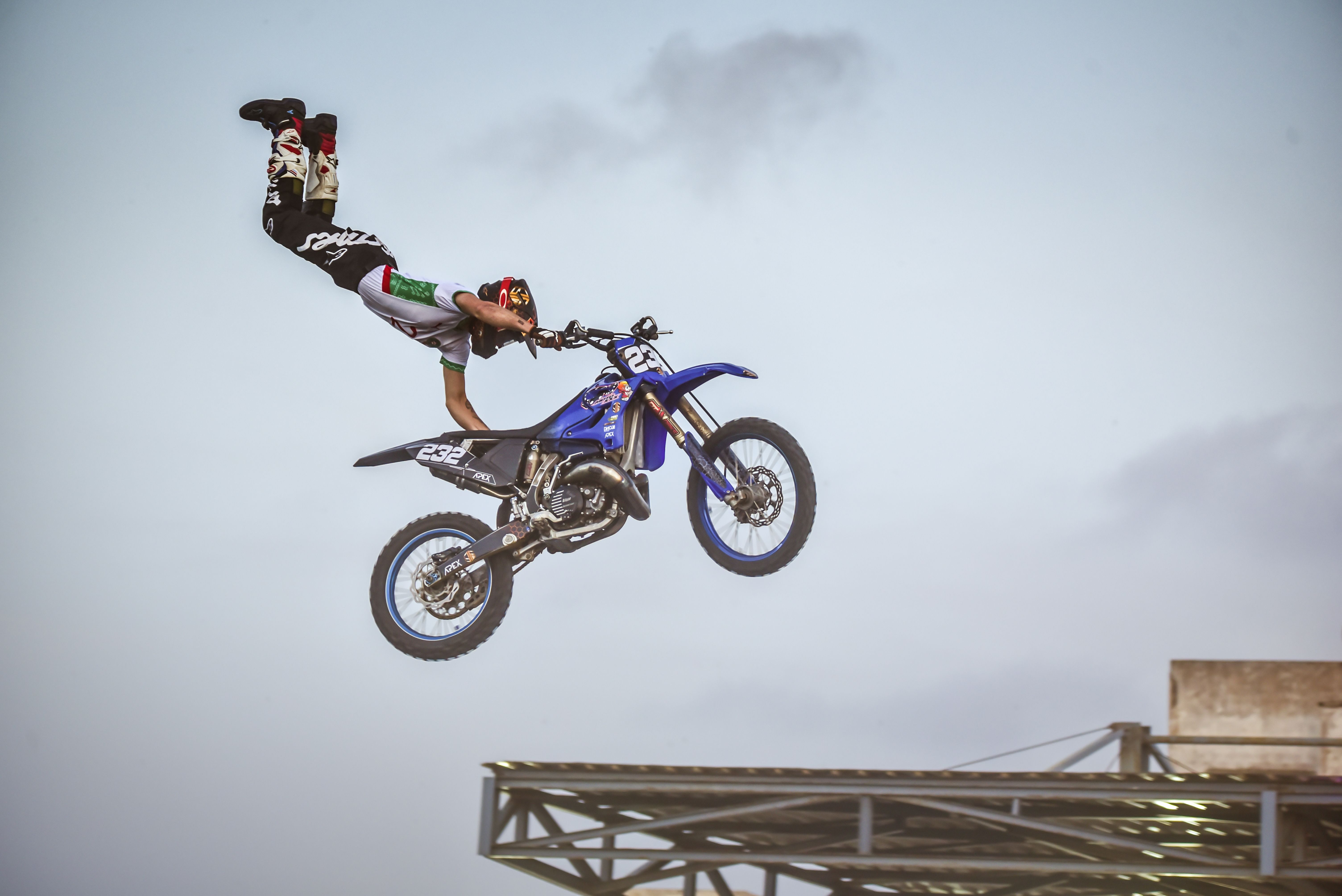 Daring Motorcycle Stunt in Rabat Sky · Free Stock Photo