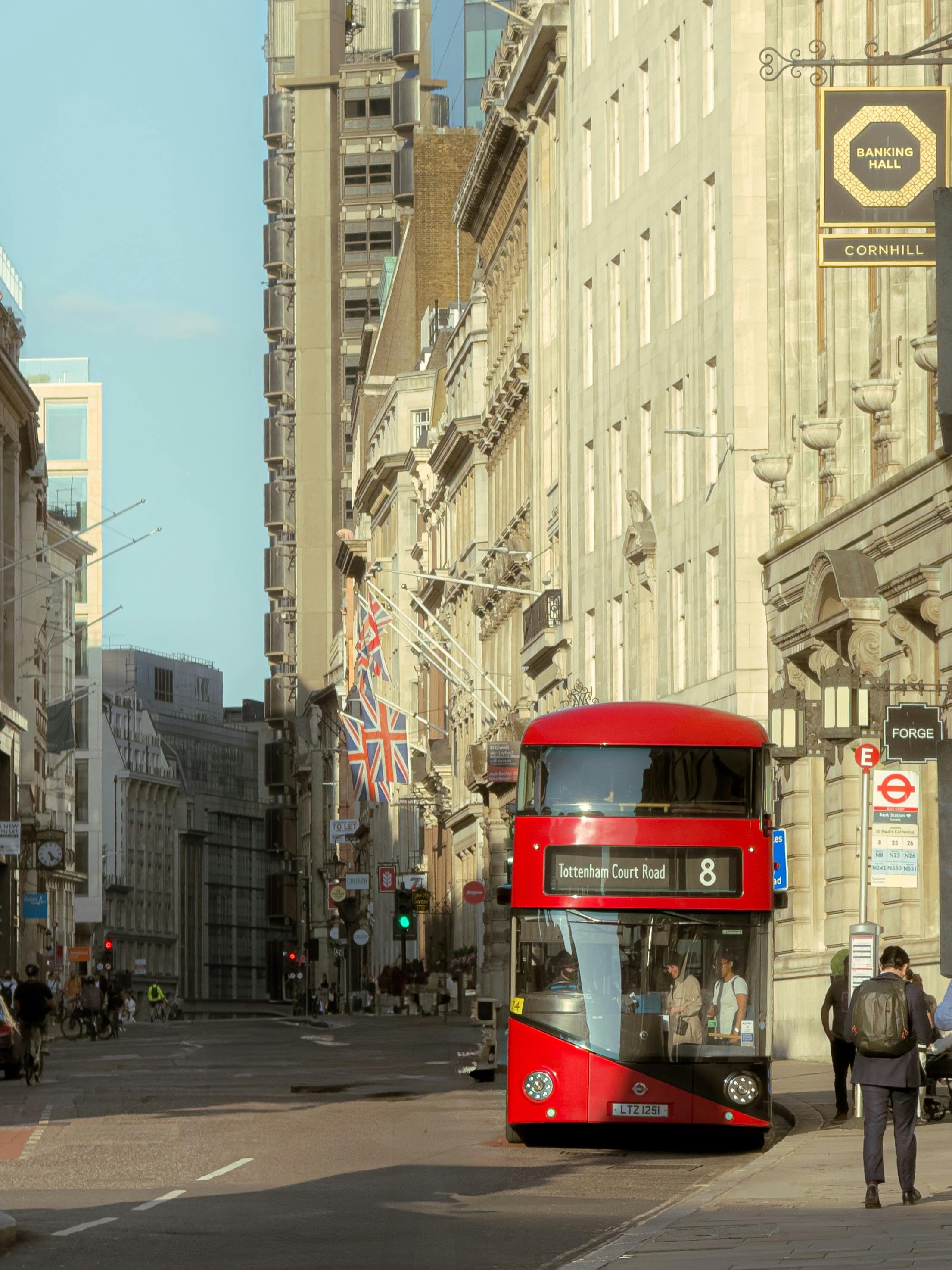 Iconic Red Bus on Tottenham Court Road, London · Free Stock Photo