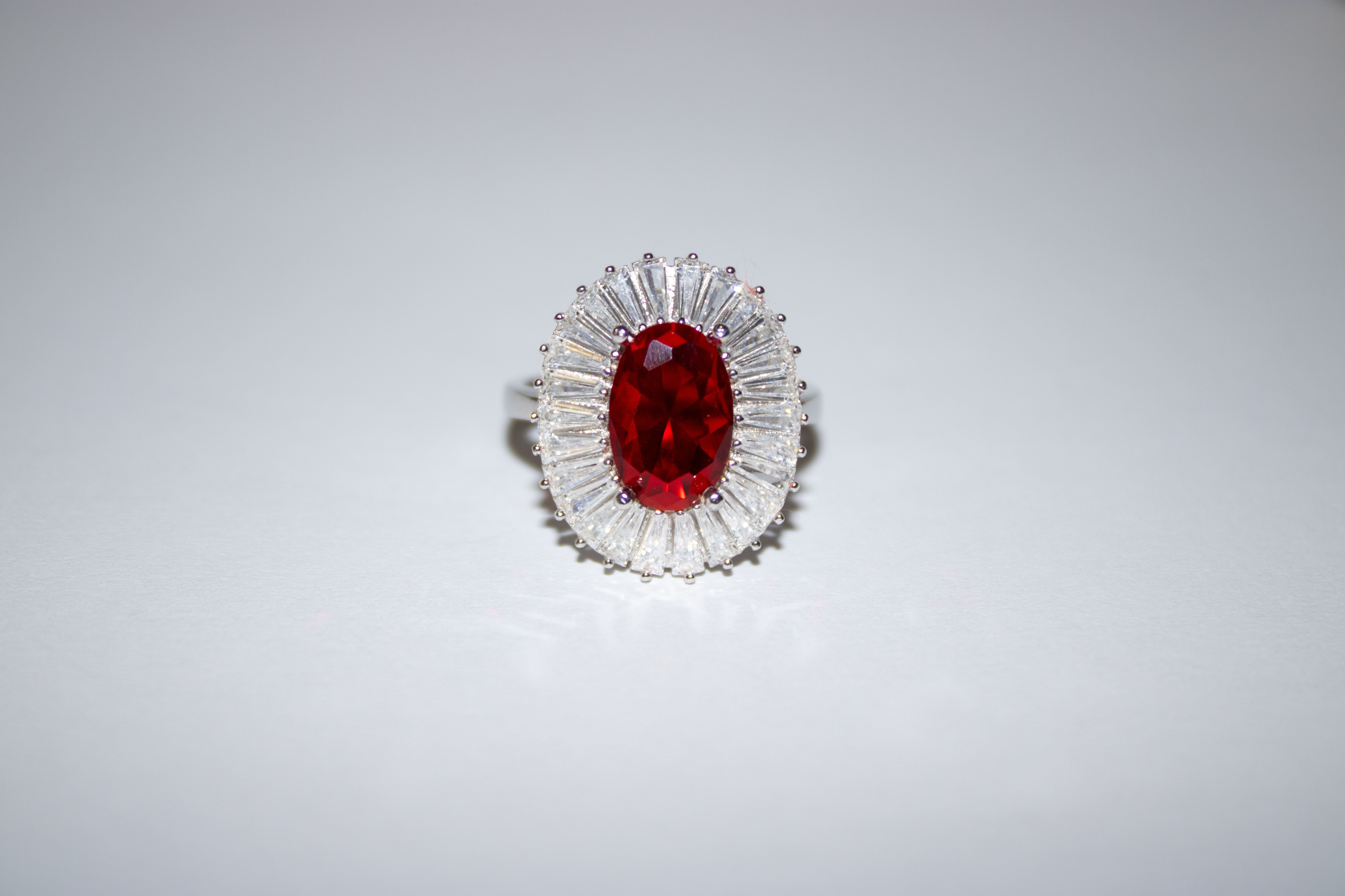 Elegant Ruby and Diamond Silver Ring on Display · Free Stock Photo