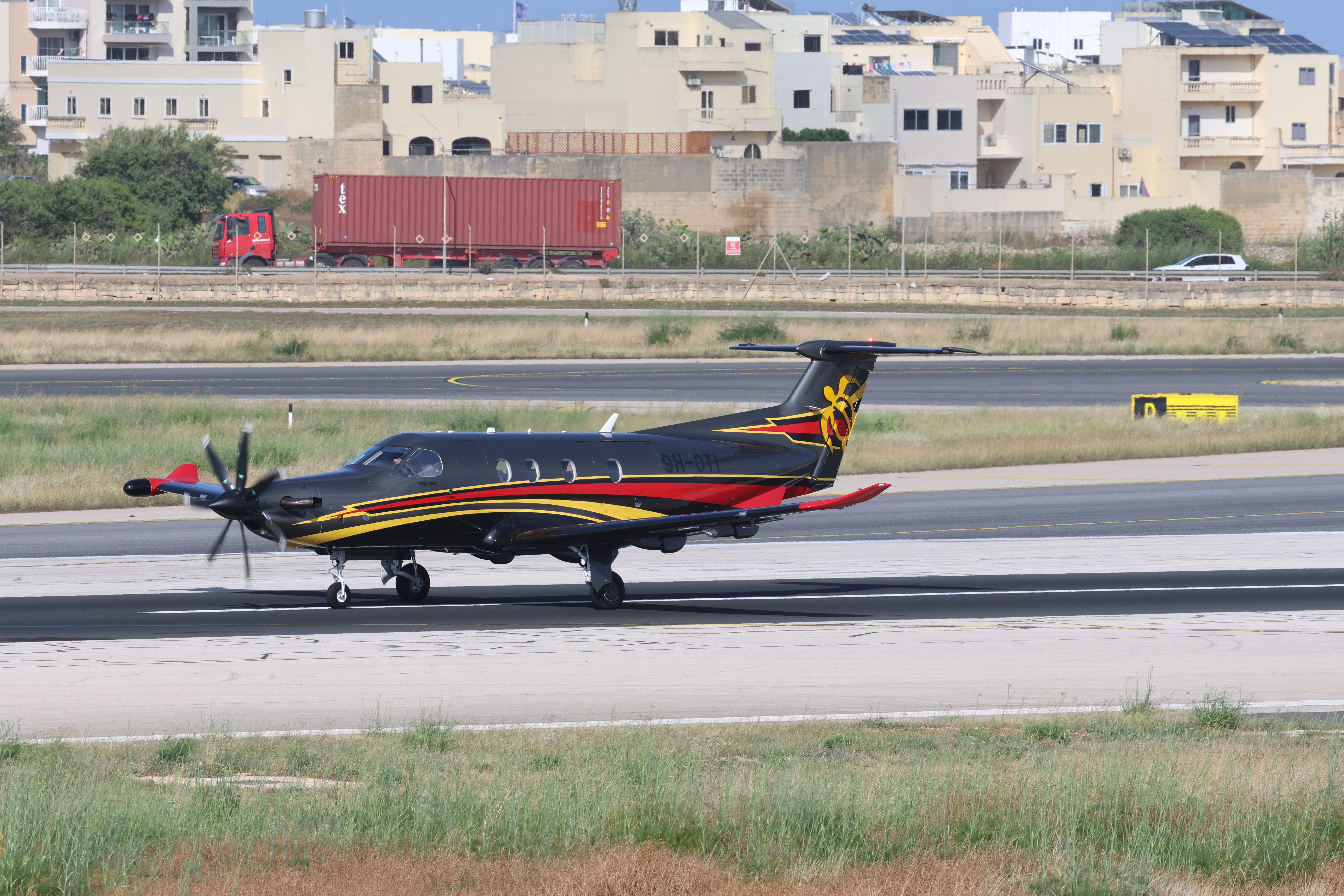 Private Aircraft on Runway at Urban Airport · Free Stock Photo