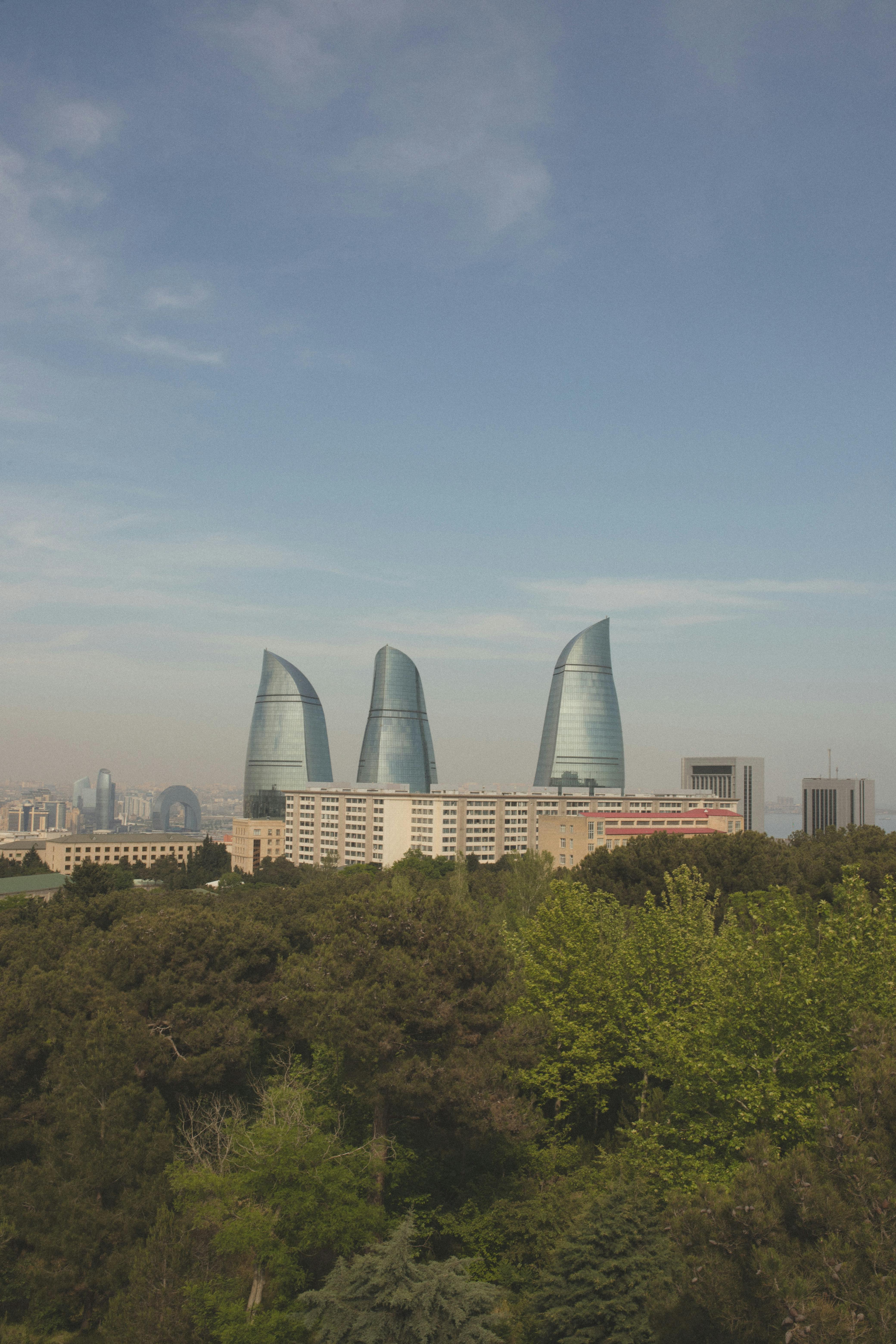Iconic Flame Towers Rising Above Baku Skyline · Free Stock Photo