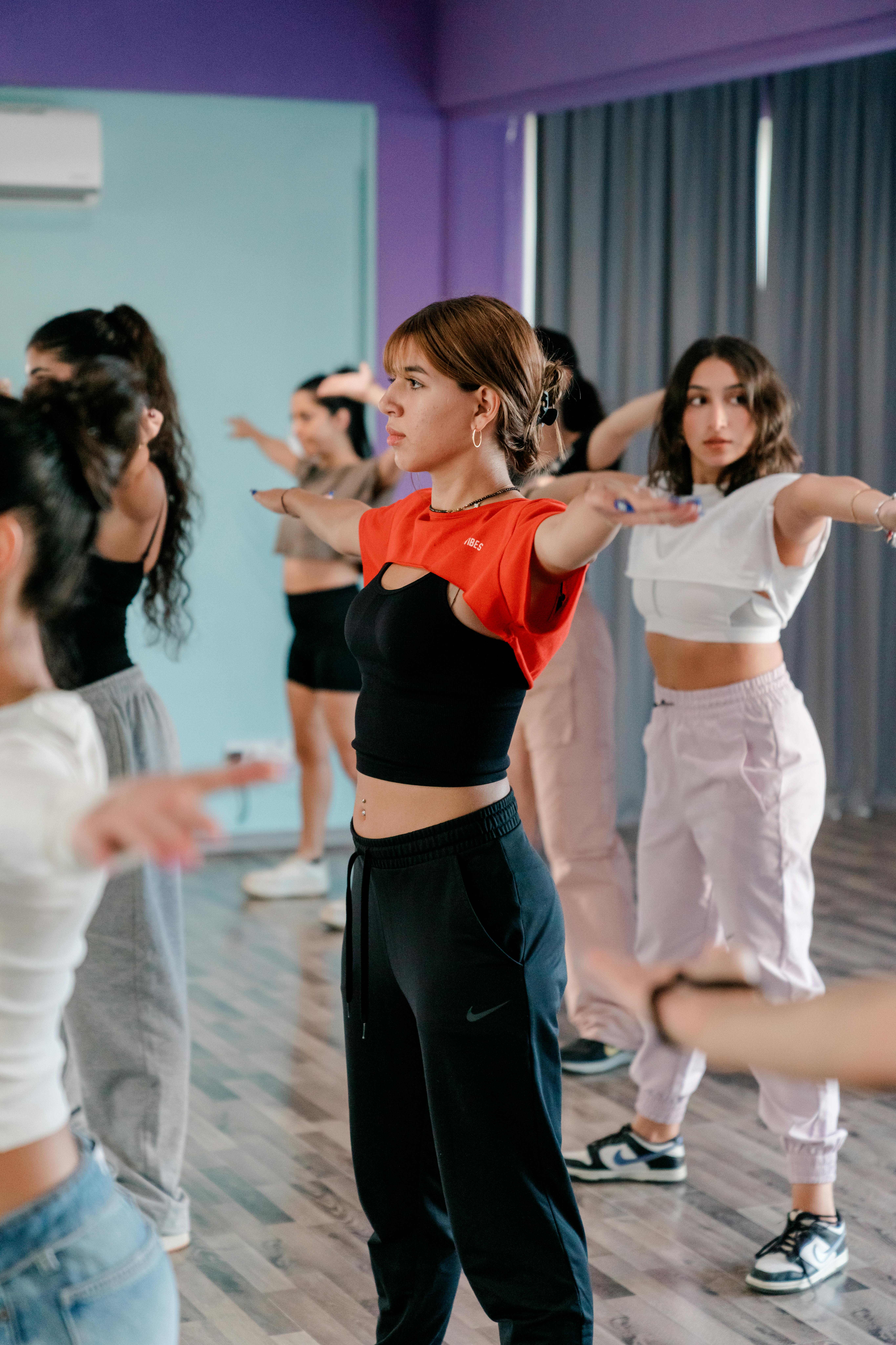 Young Women Practicing Group Dance Routine Indoors · Free Stock Photo