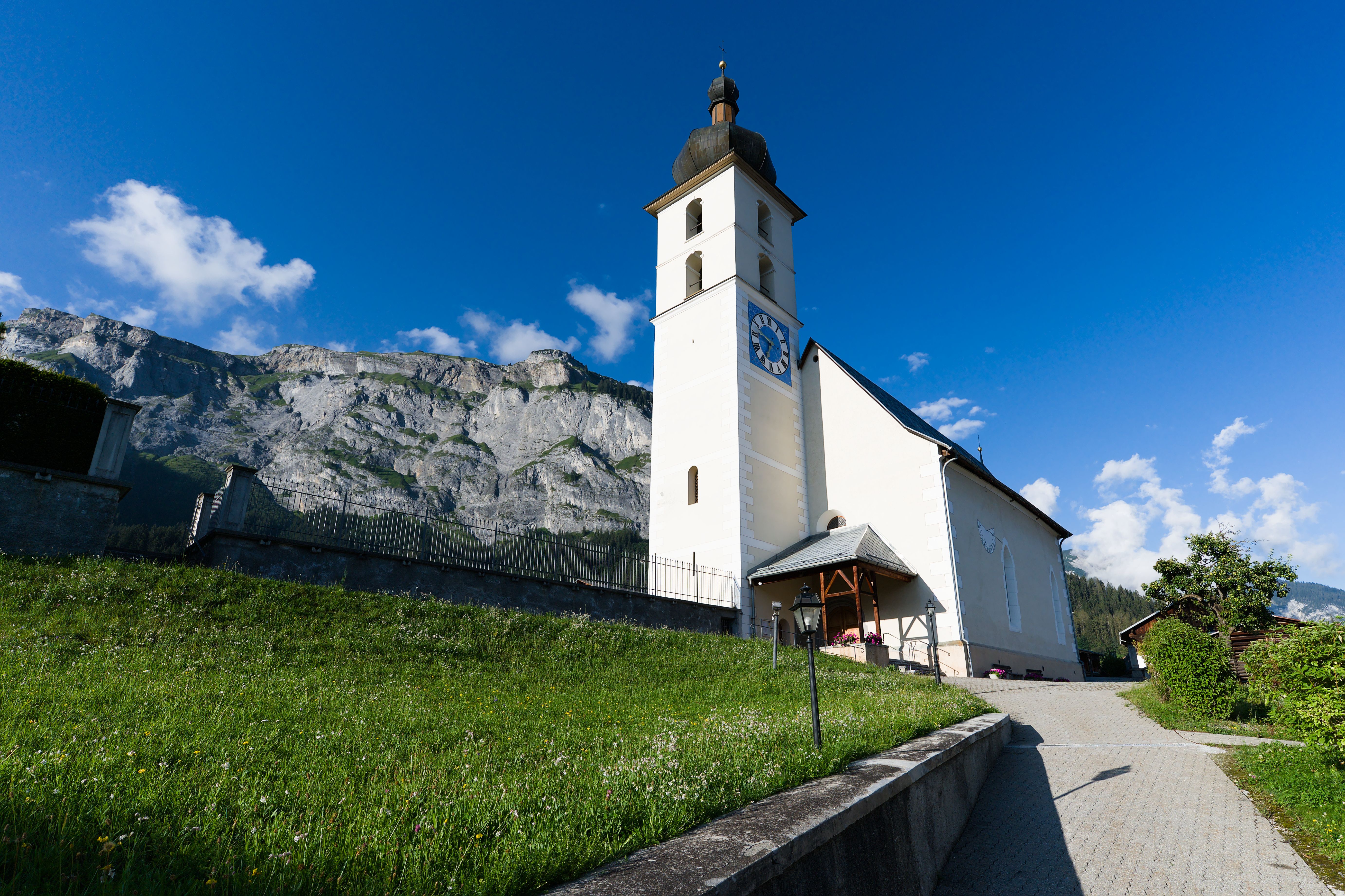 St. Martin's Church against Swiss Alps · Free Stock Photo
