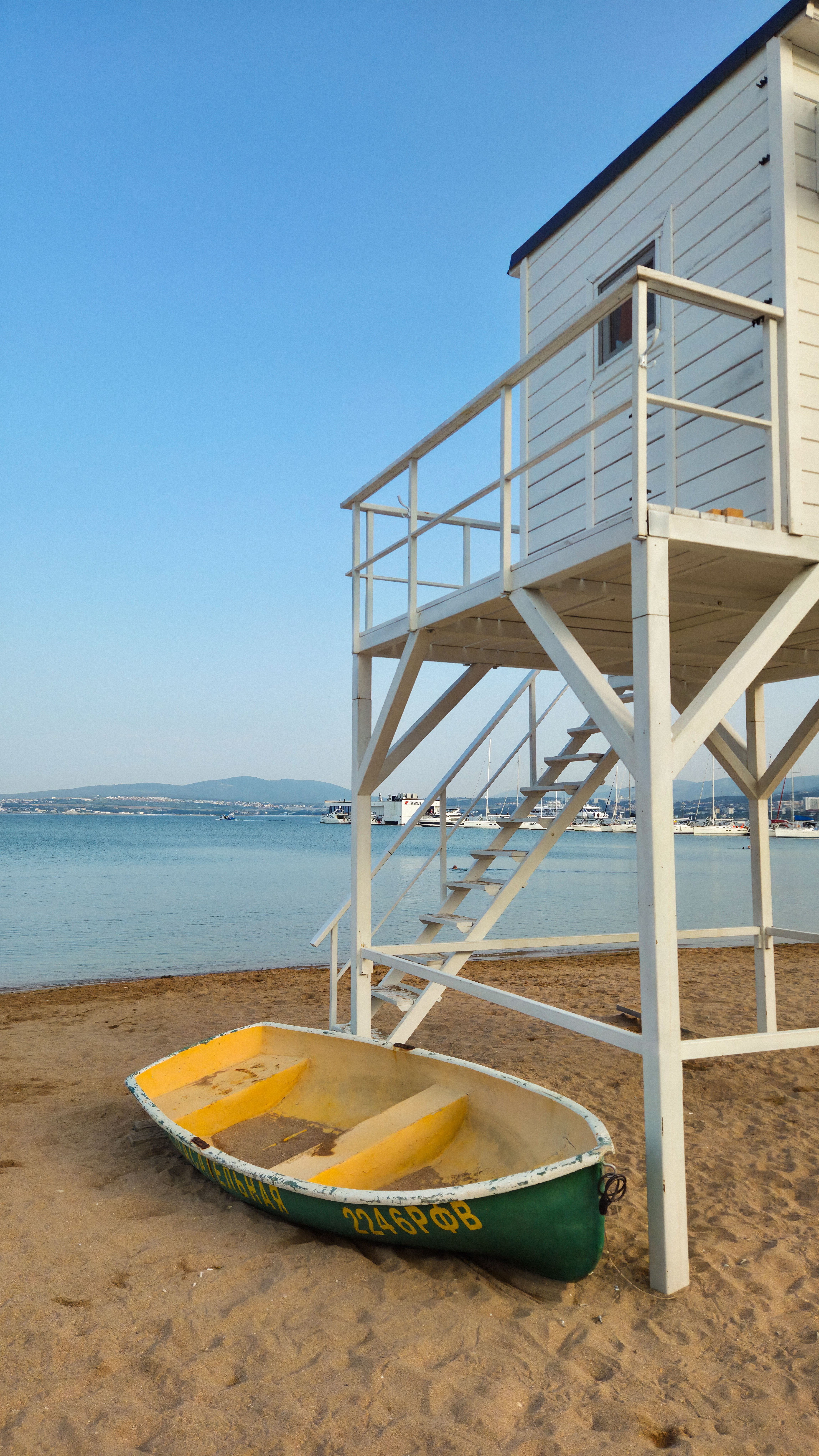 Coastal Lifeguard Tower with Rowboat on Sandy Beach · Free Stock Photo