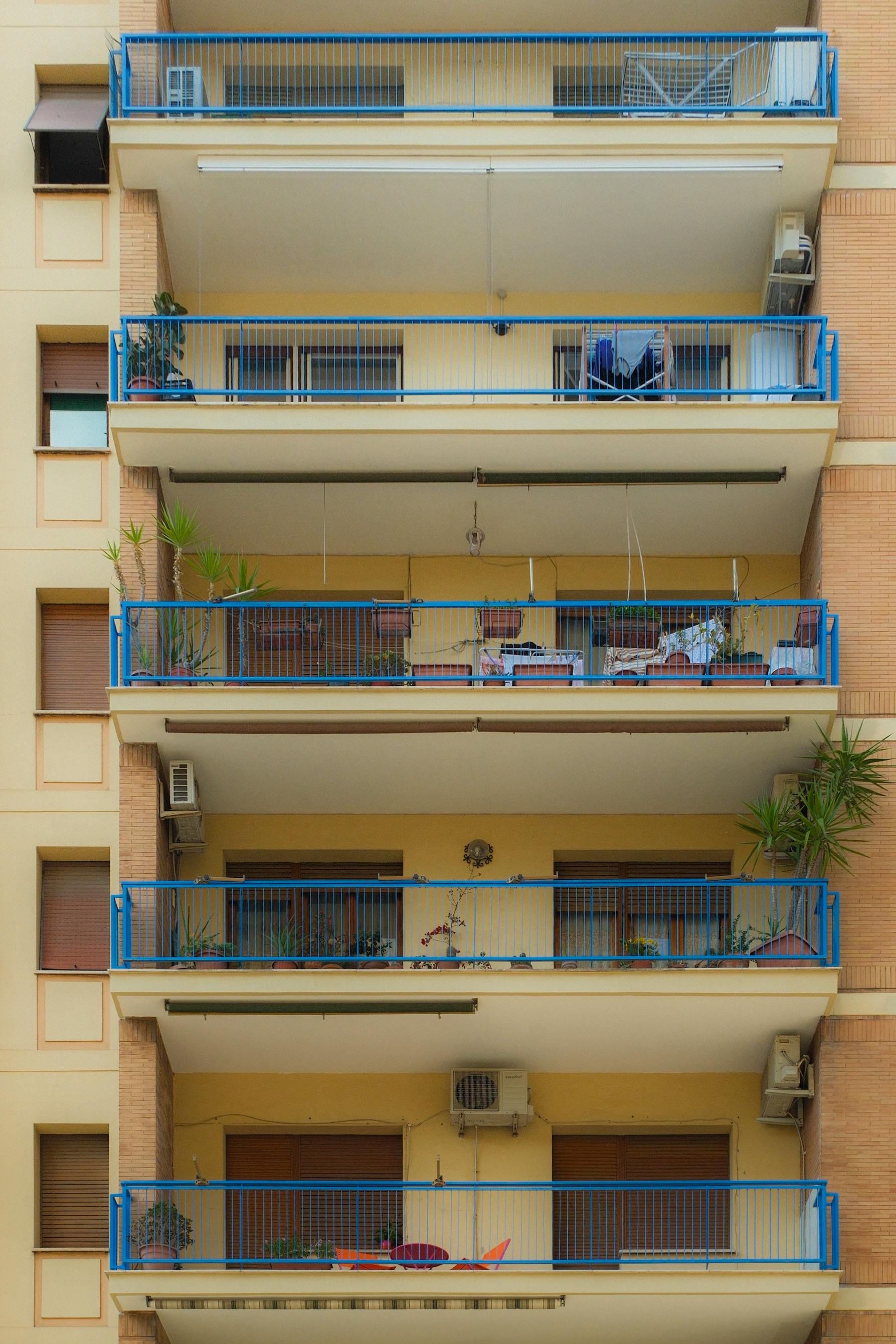 Colorful Urban Apartment Building Facade with Balconies · Free Stock Photo