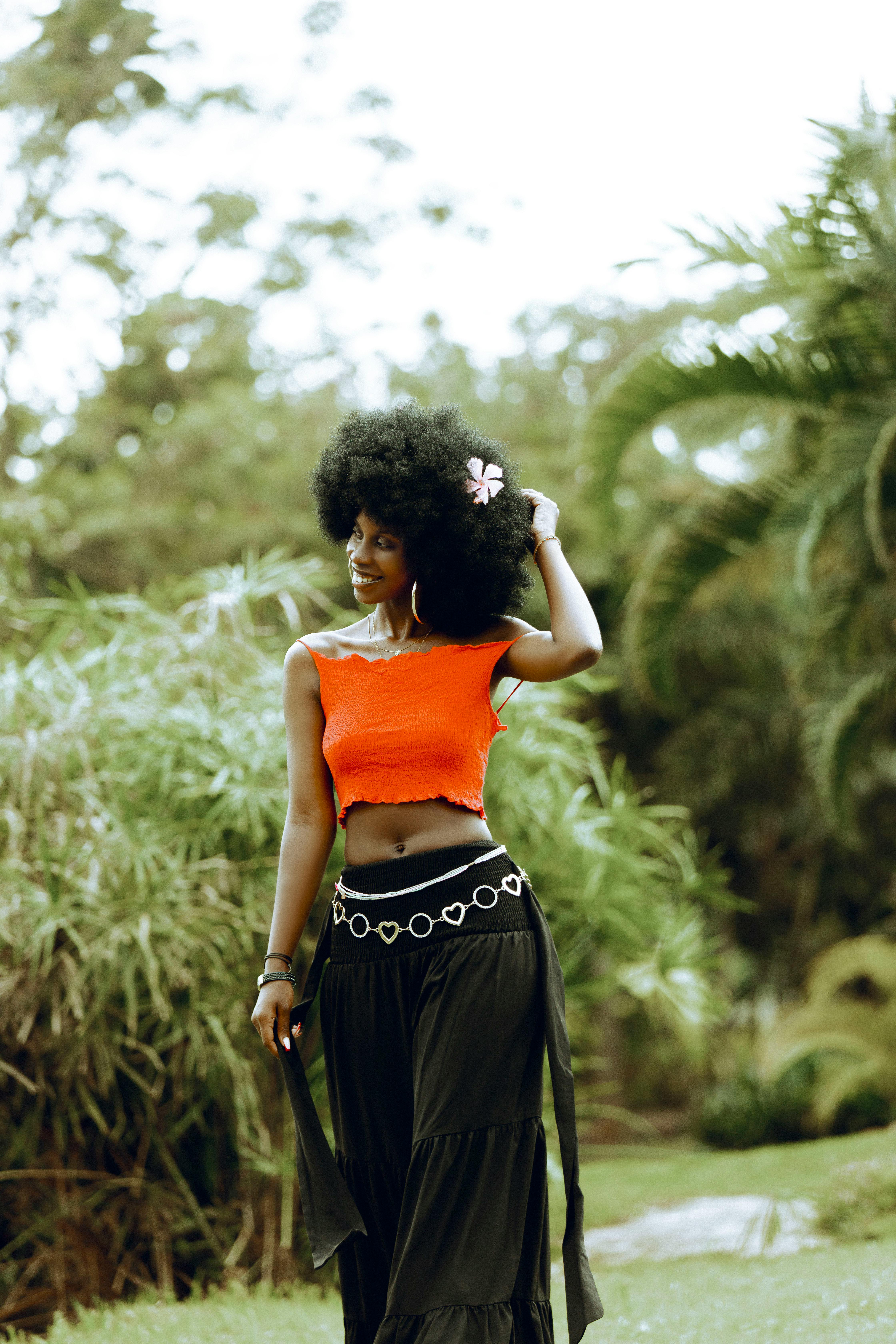 Stylish Woman in Nature with Bright Red Top · Free Stock Photo