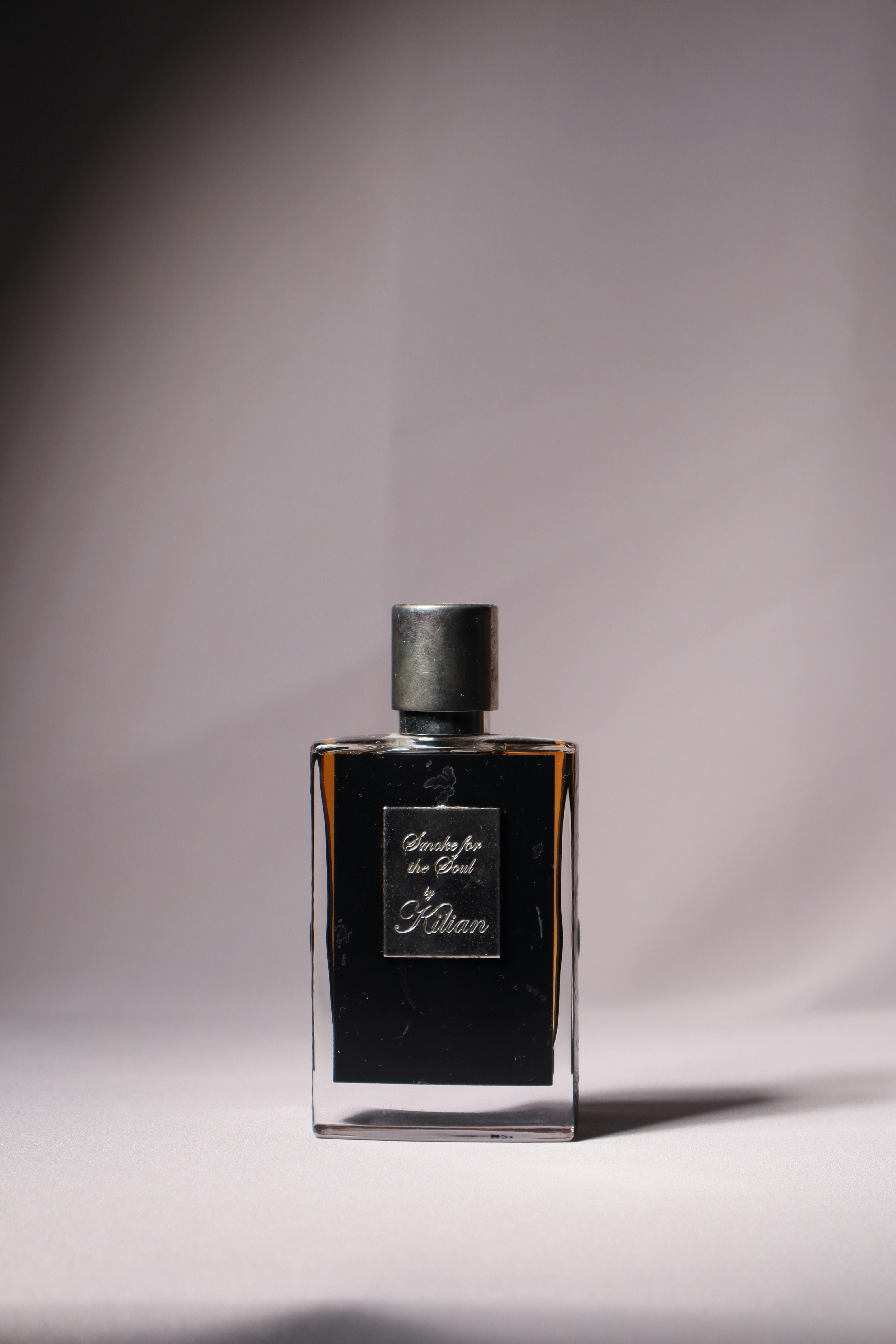 Elegant Perfume Bottle on Subtle Background · Free Stock Photo