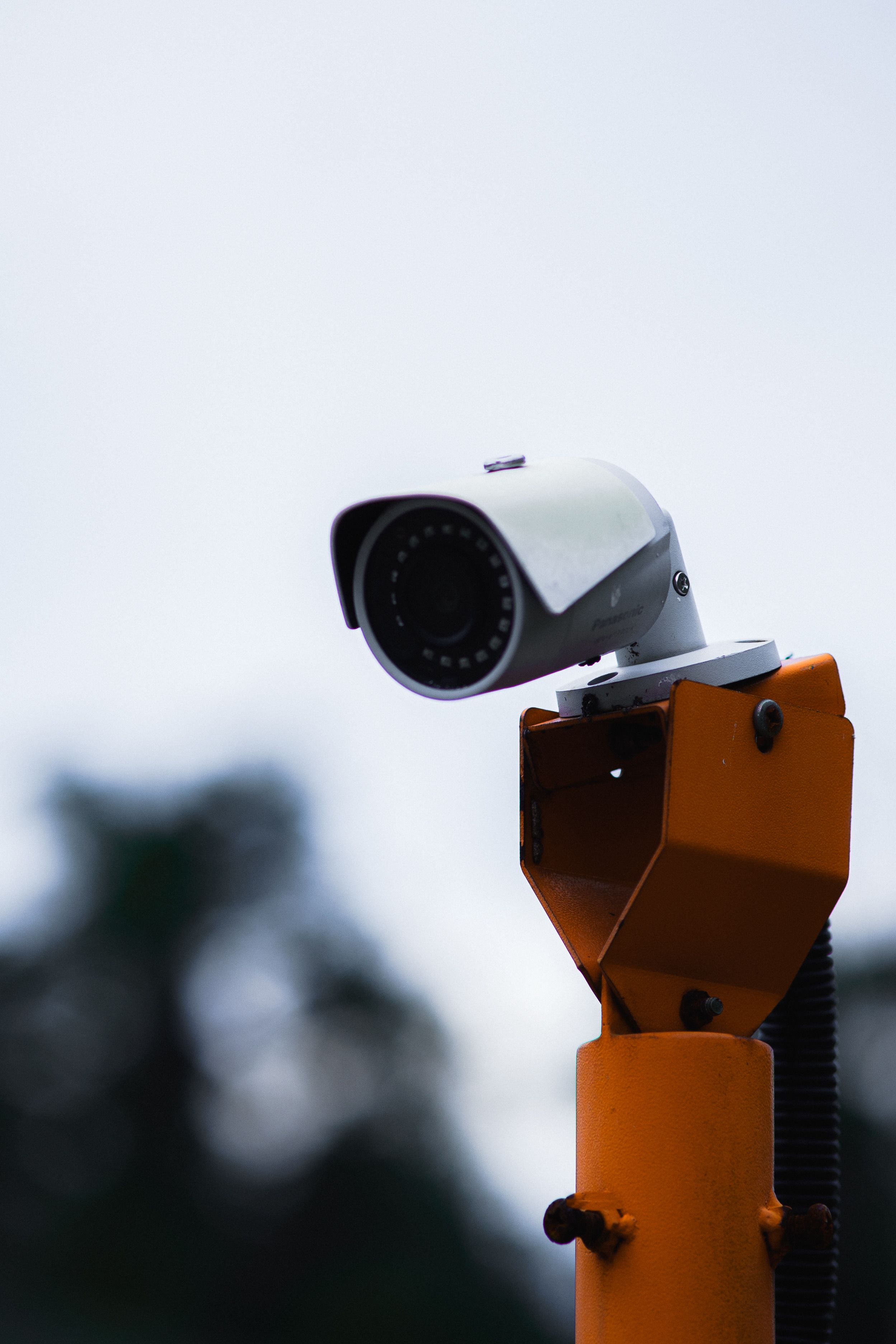 Outdoor Security Camera on Orange Stand · Free Stock Photo