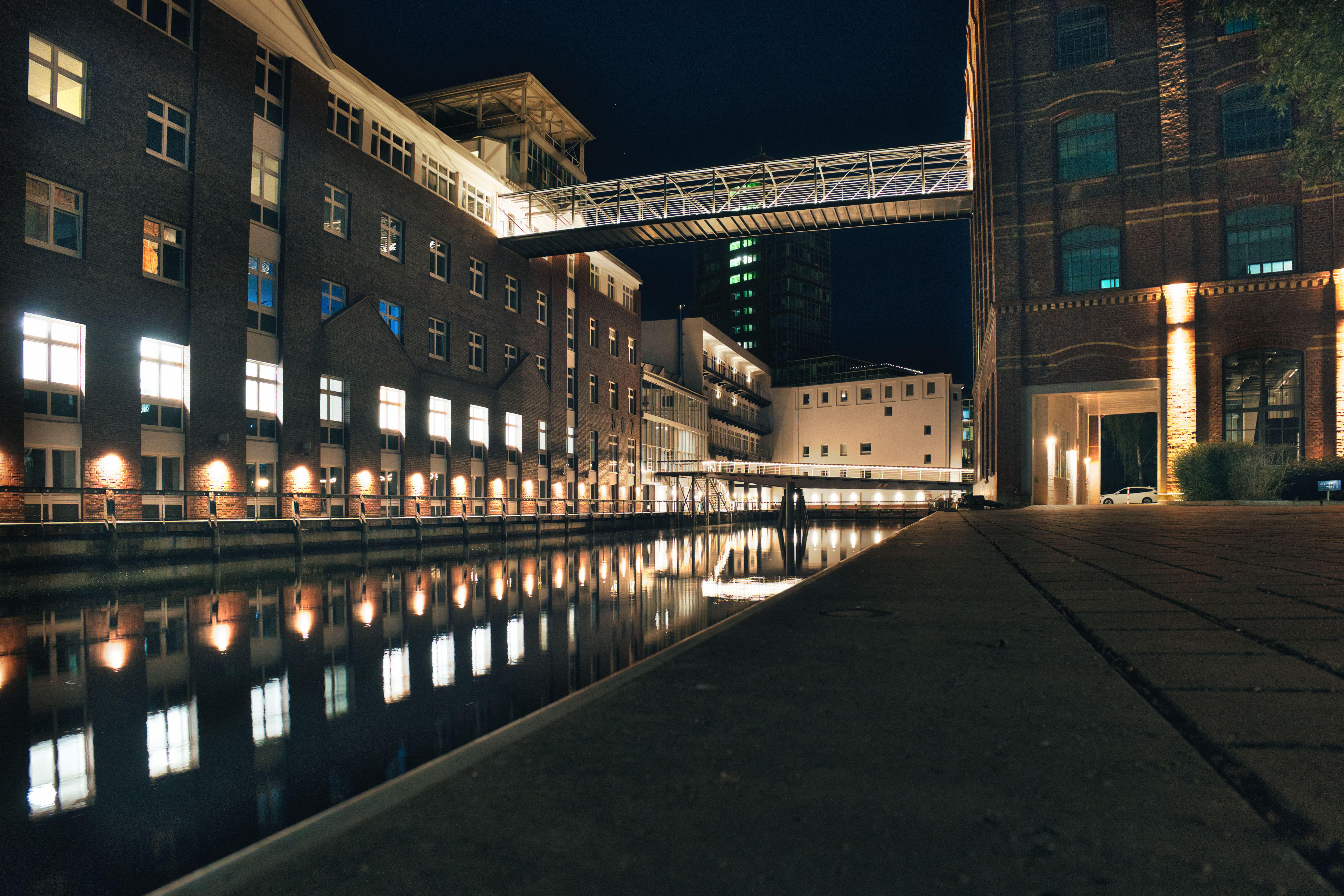 Illuminated Urban Canal Scene at Night · Free Stock Photo
