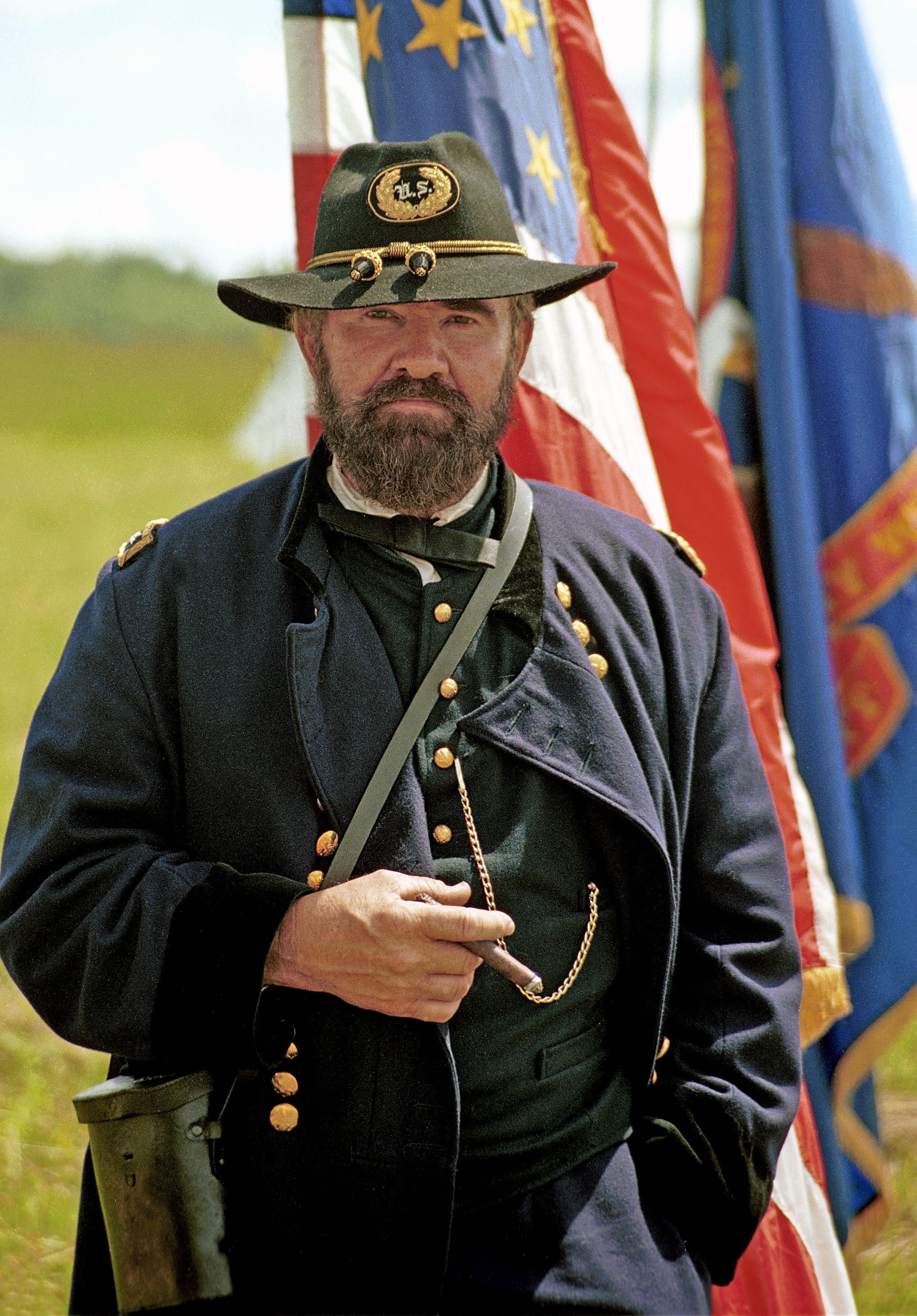 Civil War Reenactor in Union Uniform with Flag · Free Stock Photo