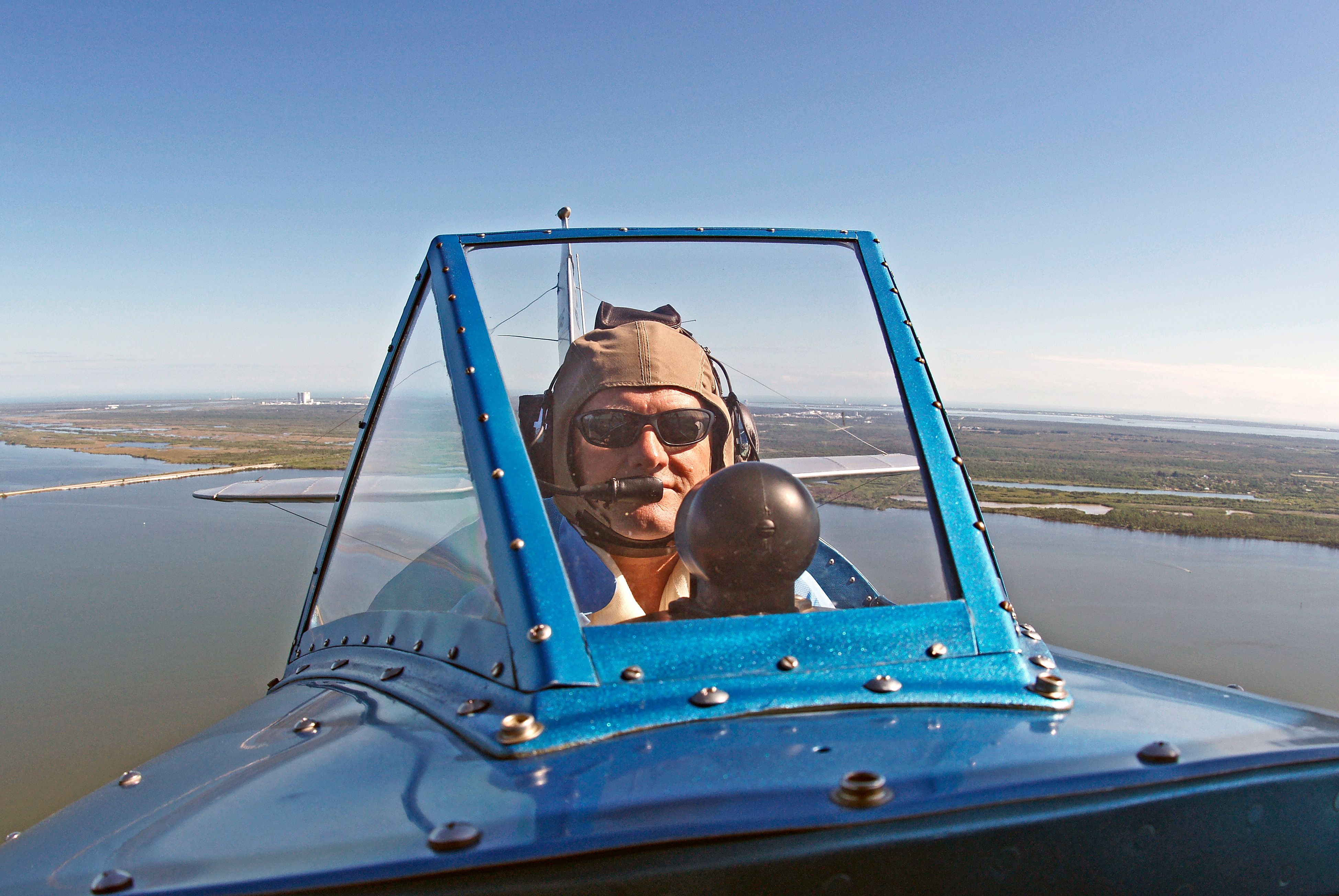 Vintage Plane with Pilot Over Florida Coast · Free Stock Photo