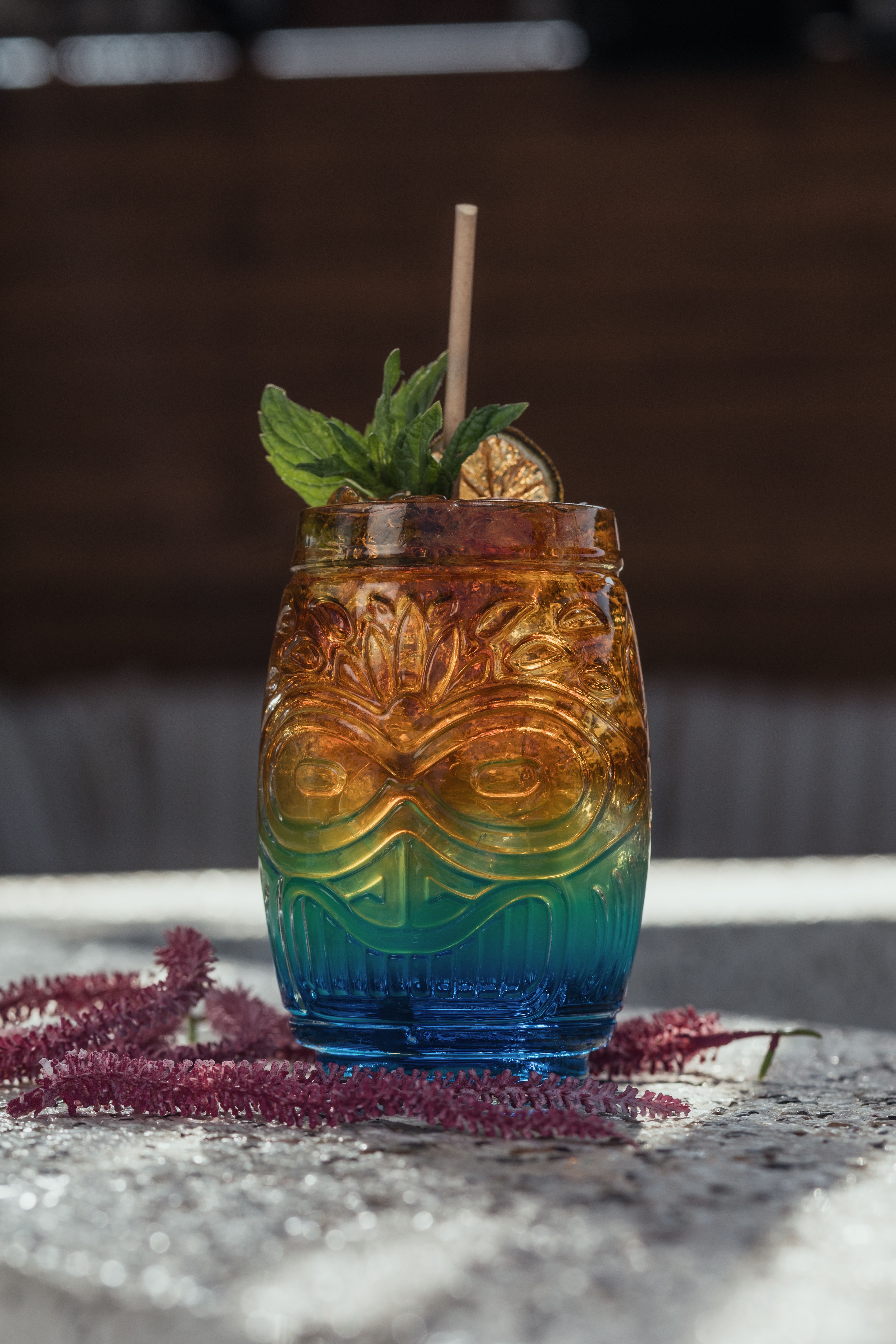 Tropical Cocktail in Decorative Glass Outdoors · Free Stock Photo