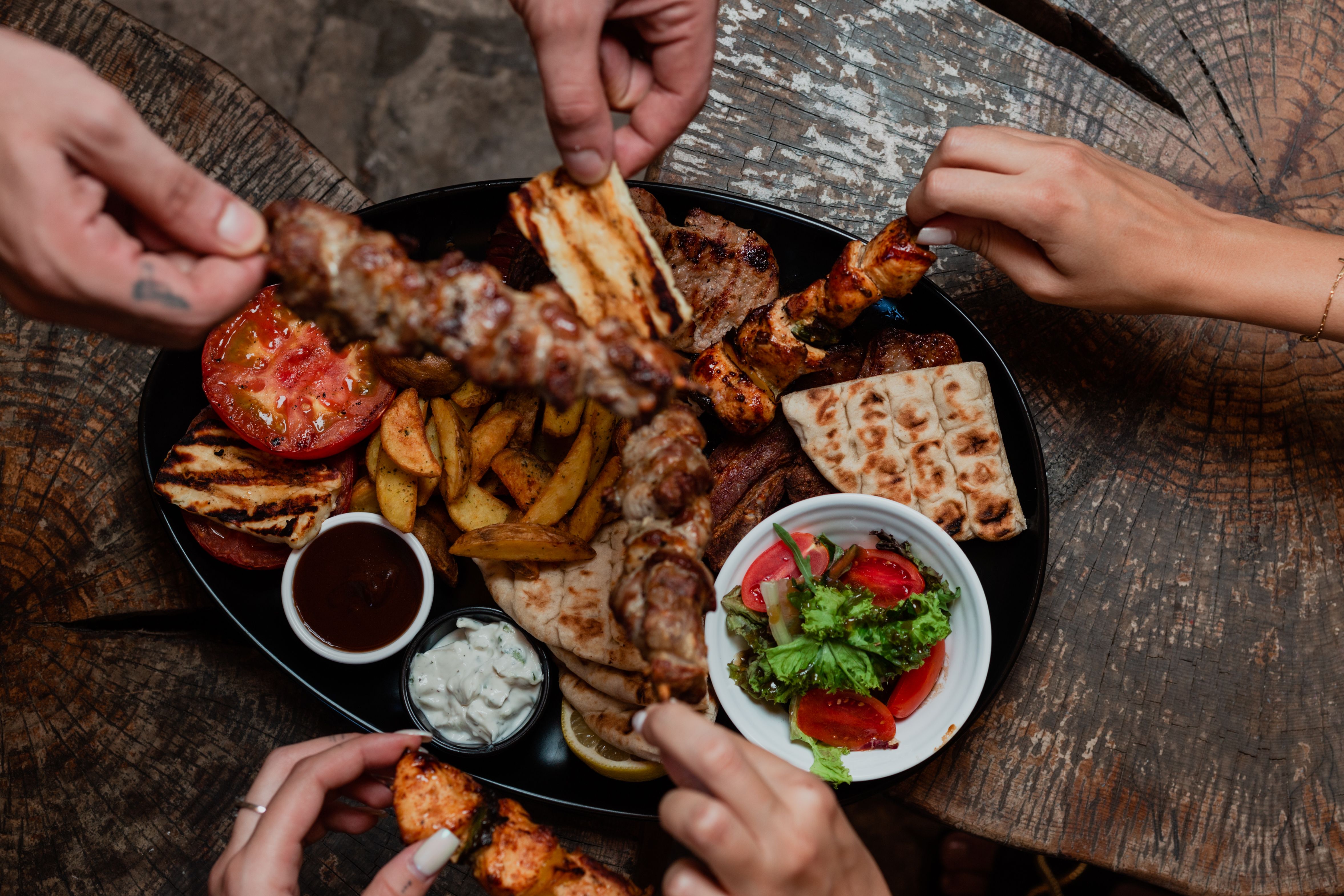 Delicious Mixed Grill Platter on Rustic Table · Free Stock Photo