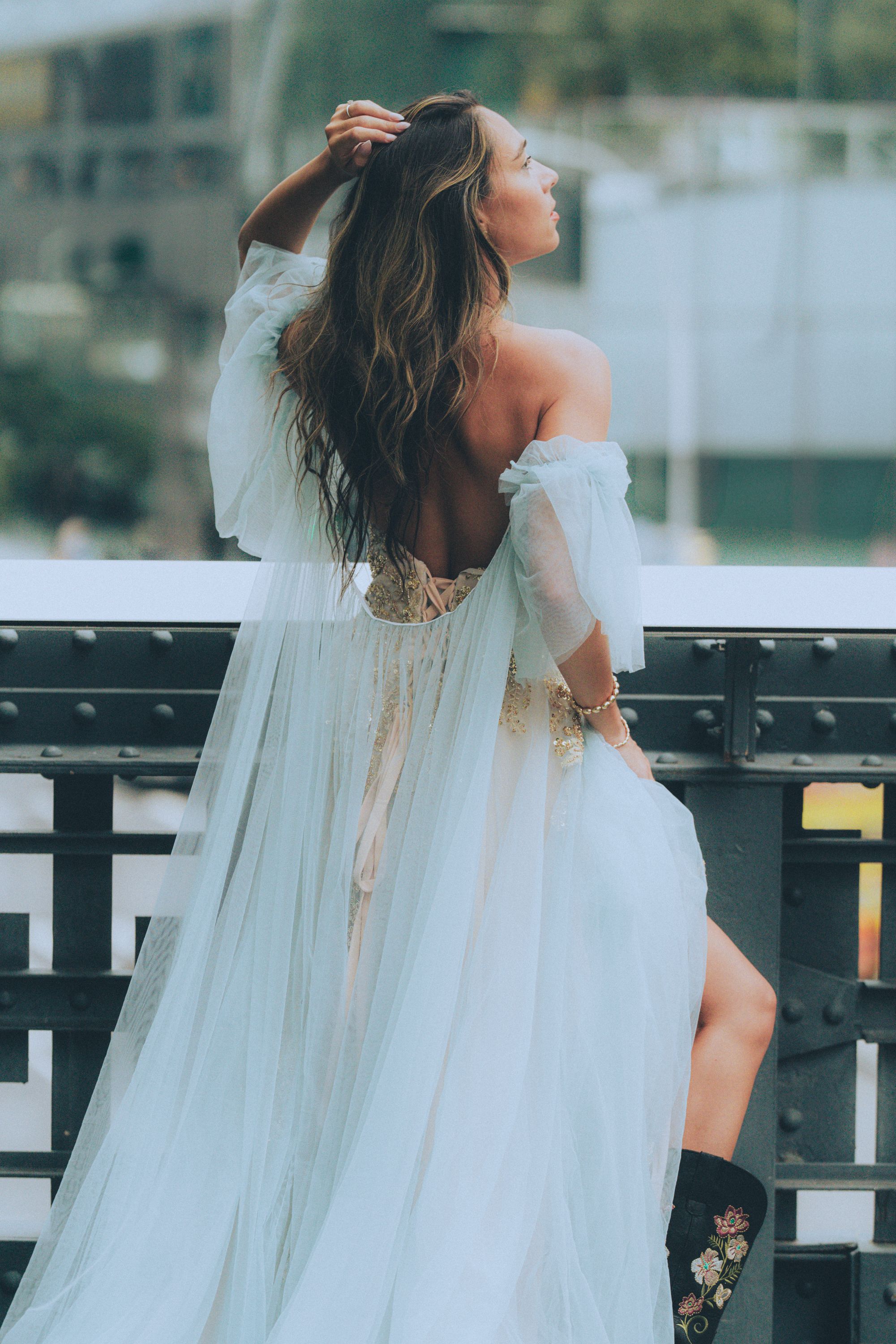 Elegant Woman in Flowing Dress Outdoors · Free Stock Photo