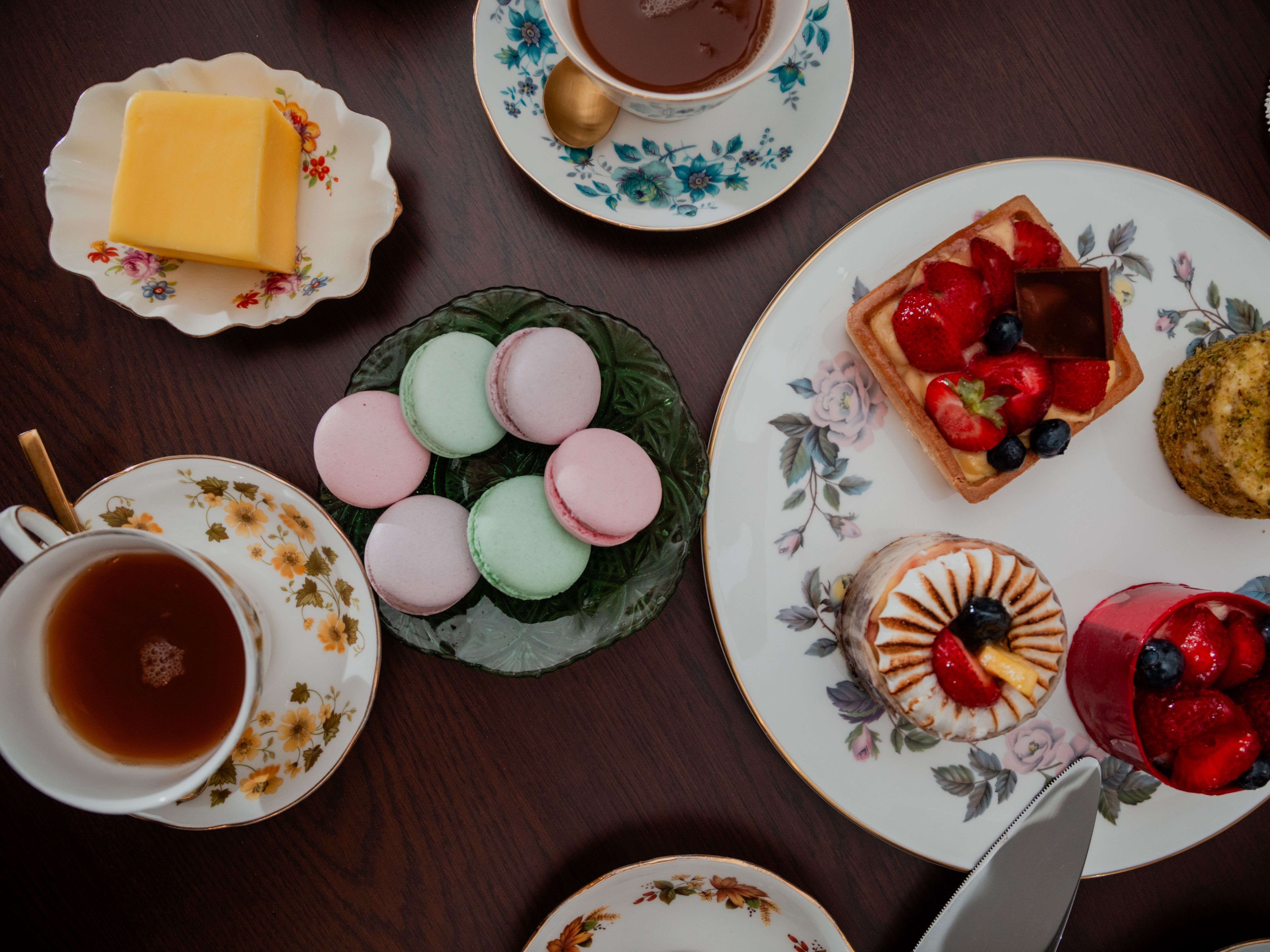 Elegant Afternoon Tea with Pastries and Macarons · Free Stock Photo