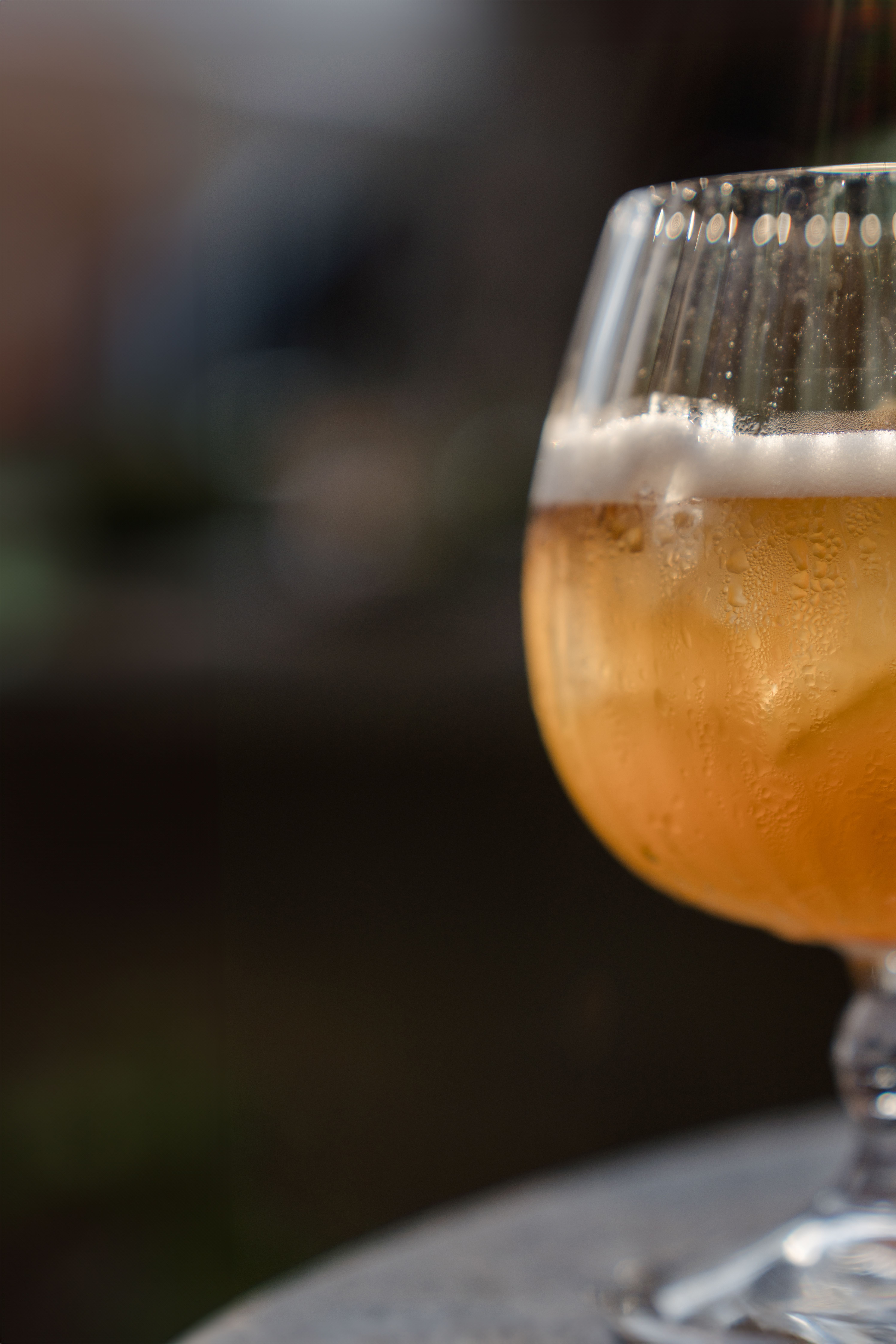 Close-Up of a Chilled Amber Beverage in Glass · Free Stock Photo