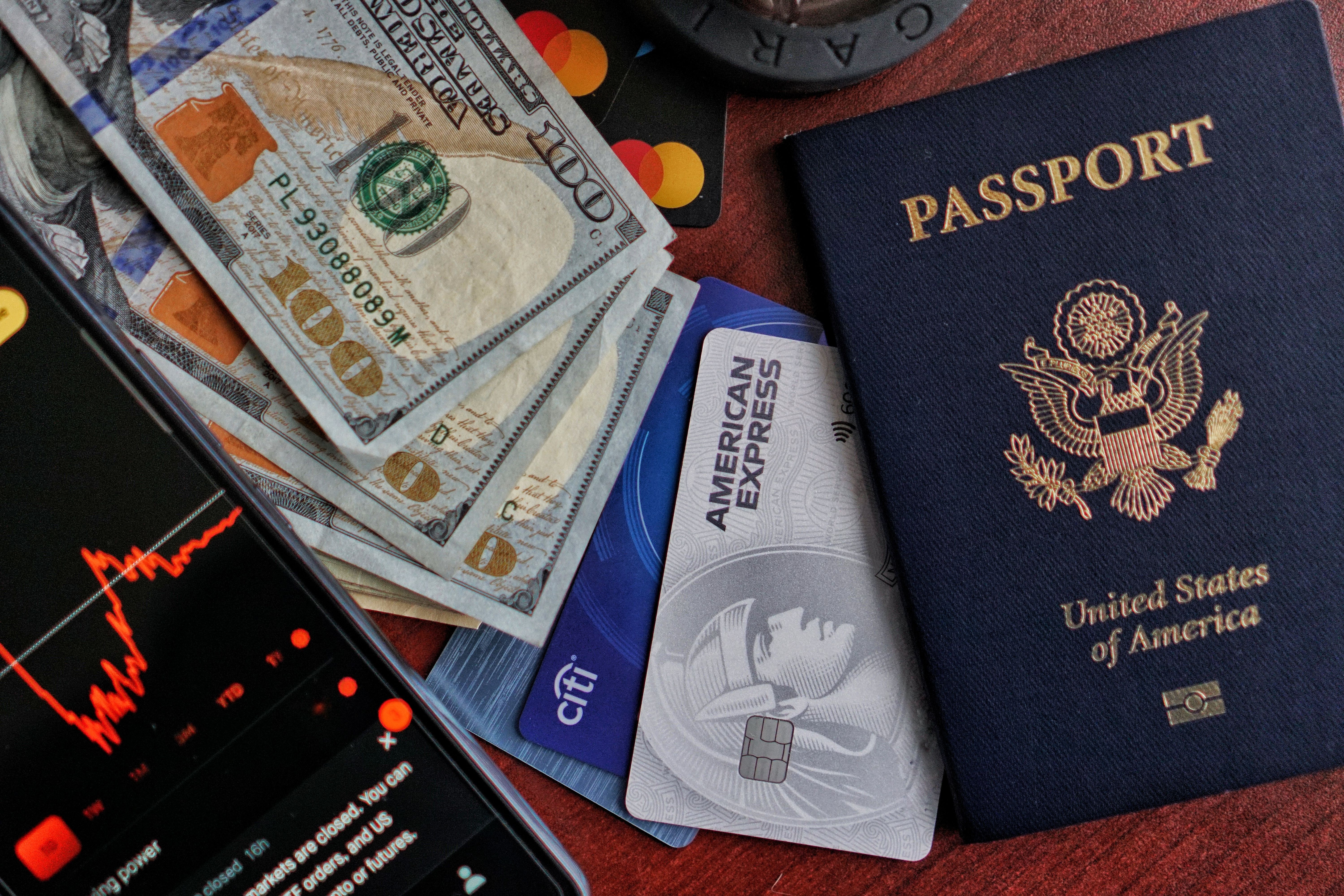 US Passport with Cash, Credit Cards, and Smartphone · Free Stock Photo