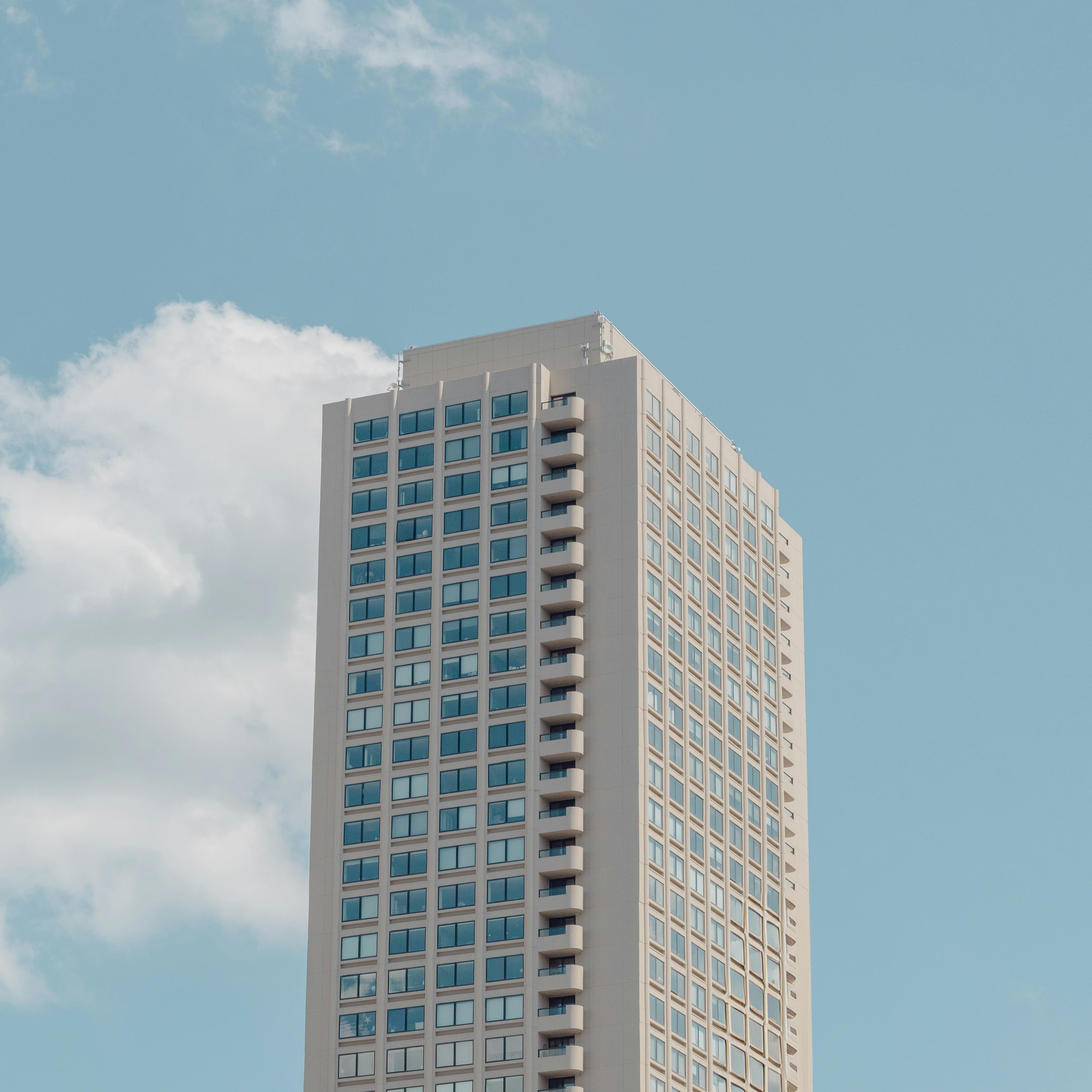 Modern Skyscraper Against Blue Sky · Free Stock Photo