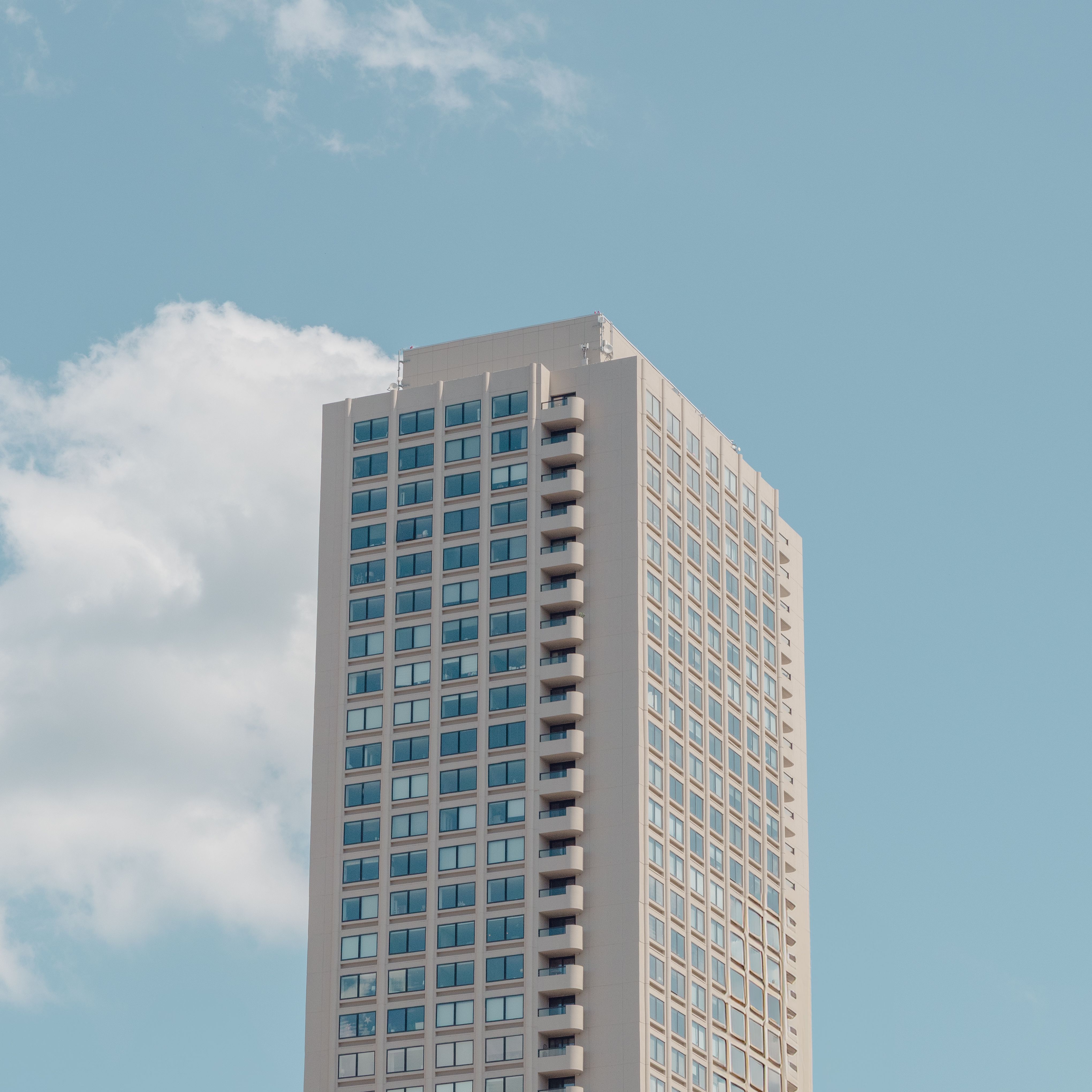 Modern Skyscraper Against Blue Sky · Free Stock Photo