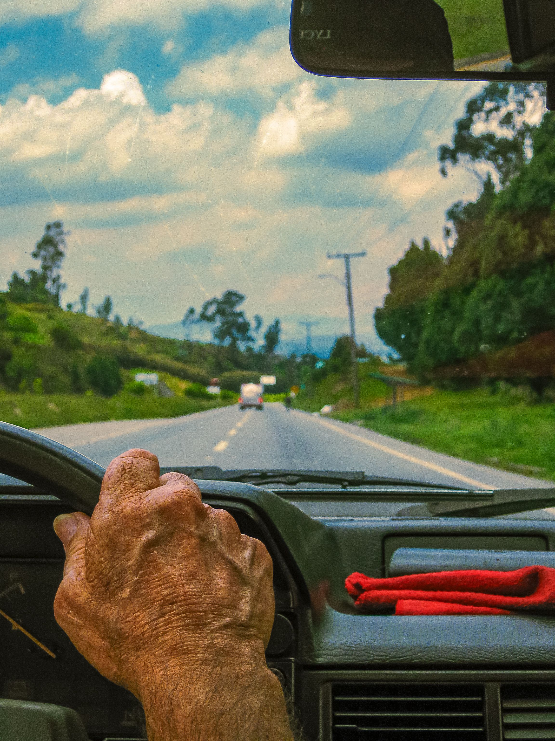 Driving Through Scenic Countryside Road · Free Stock Photo