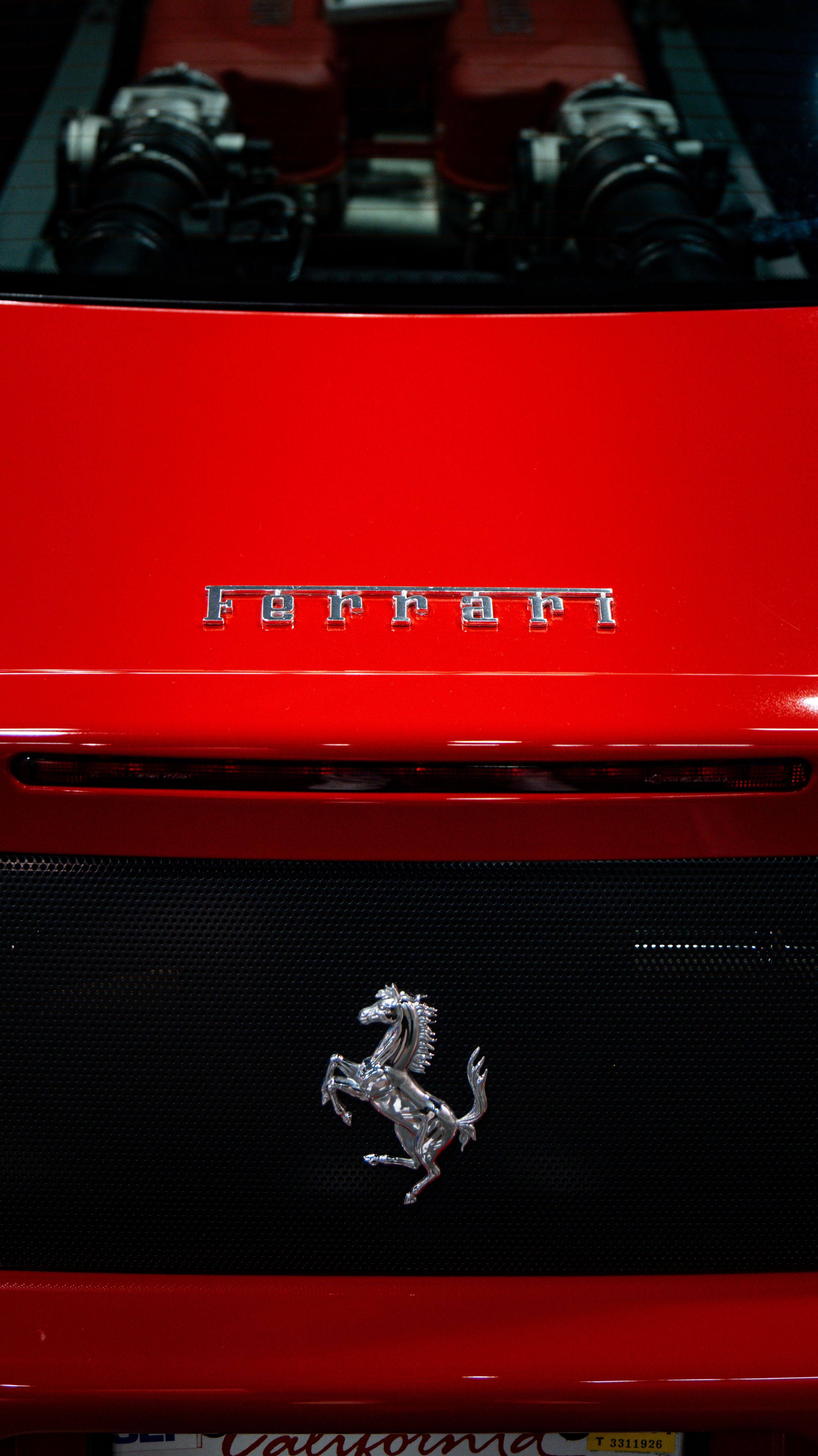 Red Sports Car with Iconic Branding · Free Stock Photo