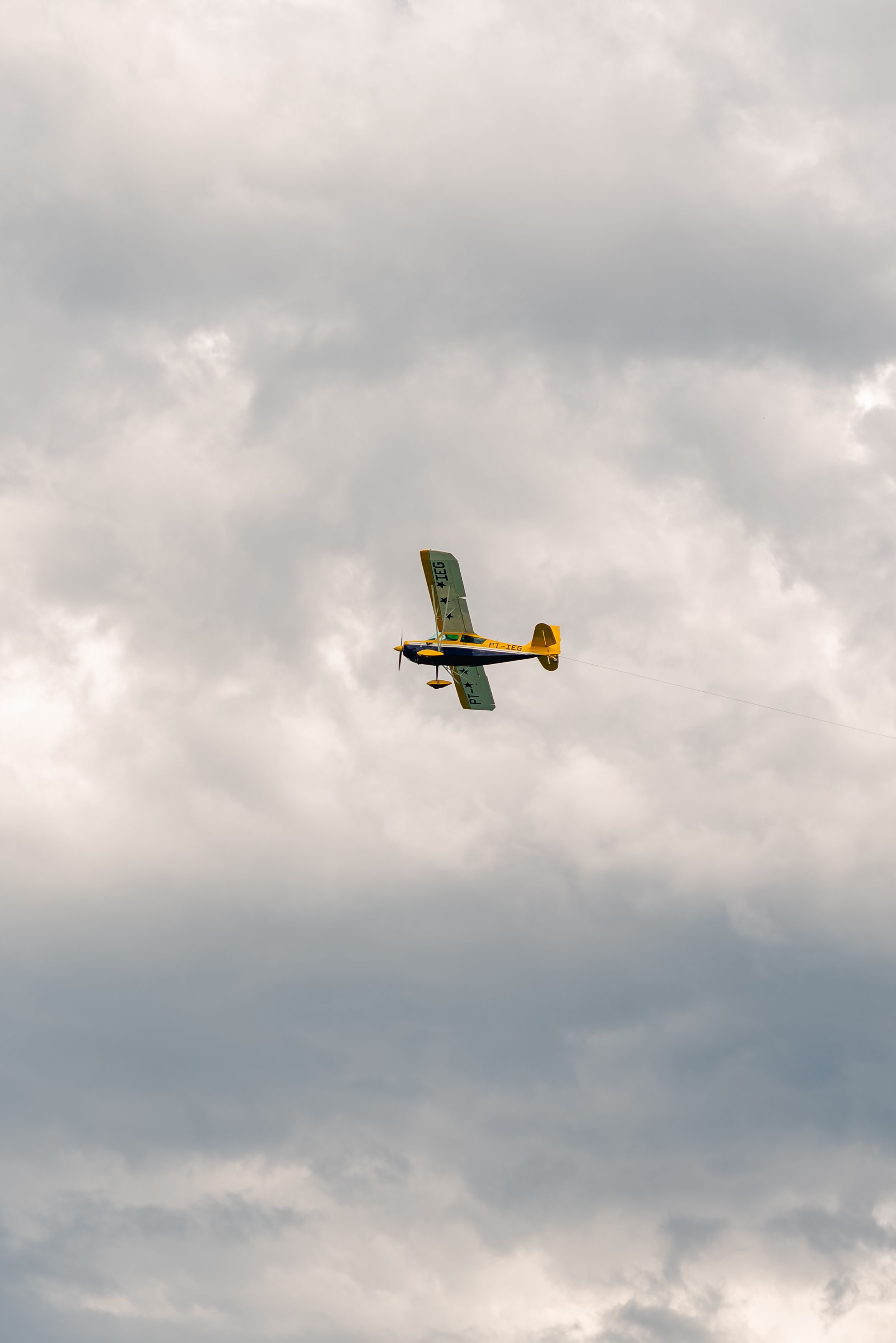 Brown Propeller Plane Under Cloudy Sky during Daytime · Free Stock Photo