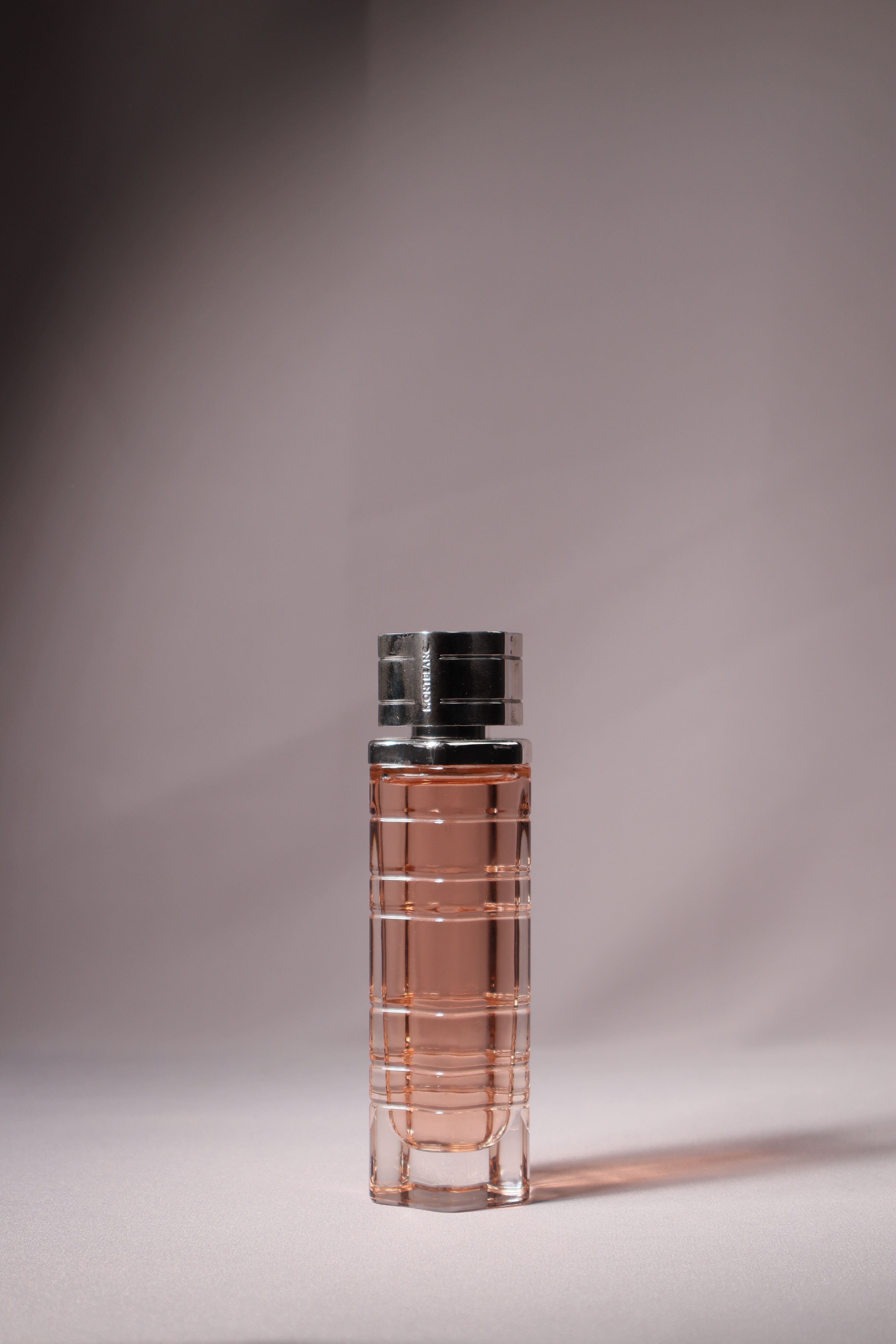 Elegant Perfume Bottle on Minimalist Background · Free Stock Photo