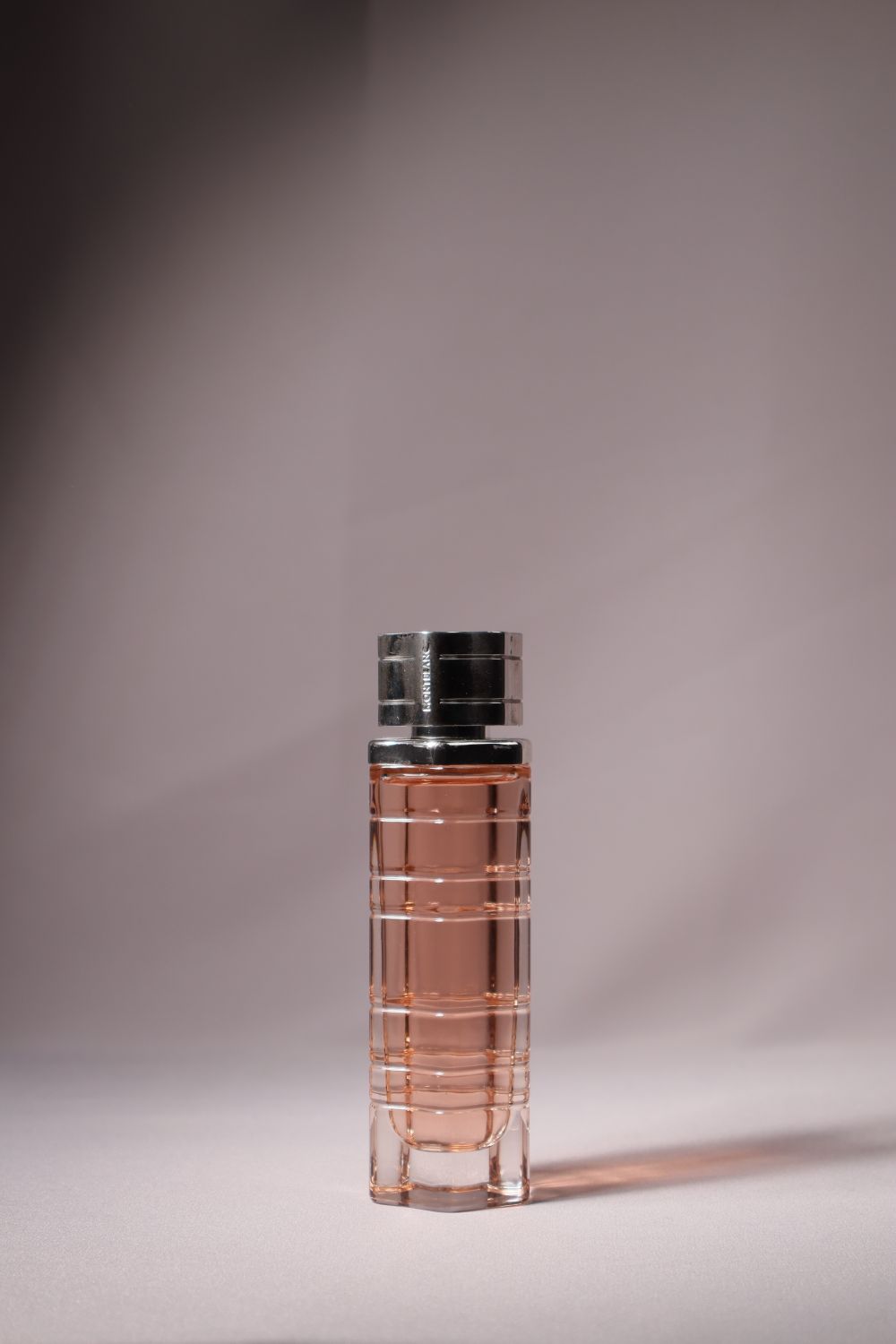 Elegant Perfume Bottle on Minimalist Background · Free Stock Photo