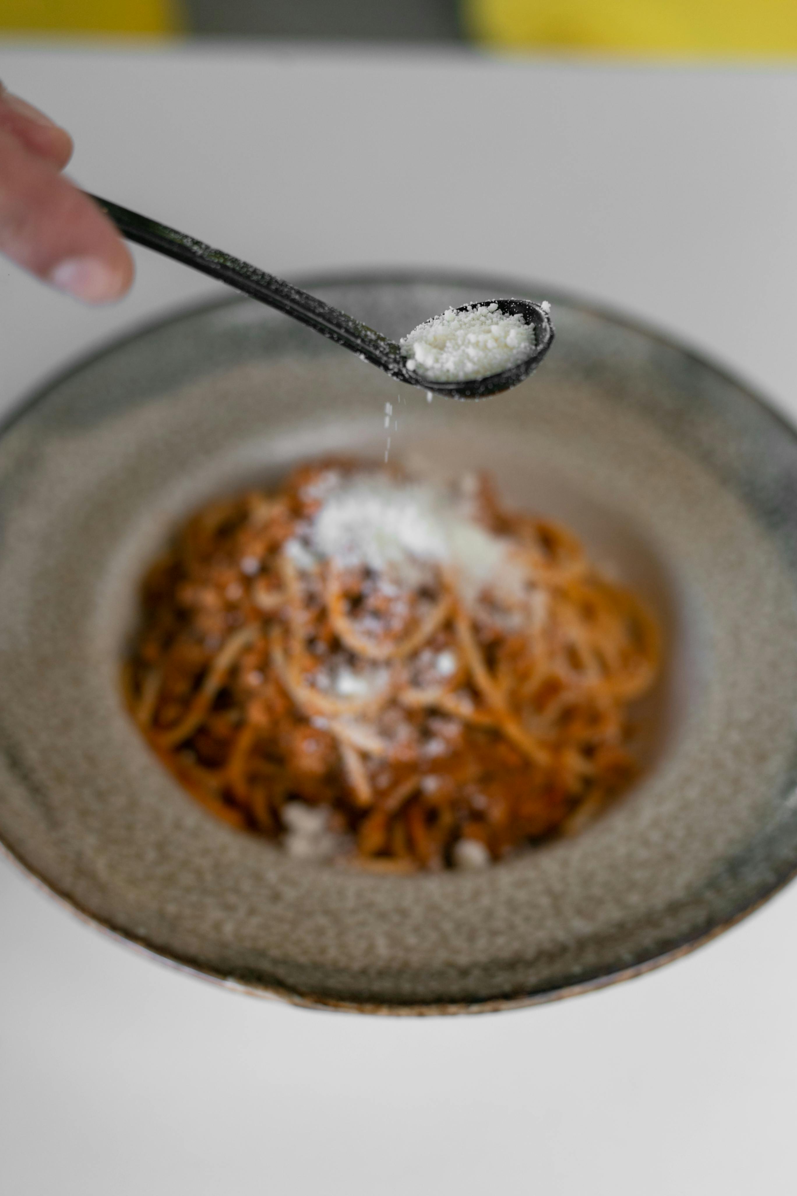 Spaghetti Bolognese with Parmesan Cheese Topping · Free Stock Photo