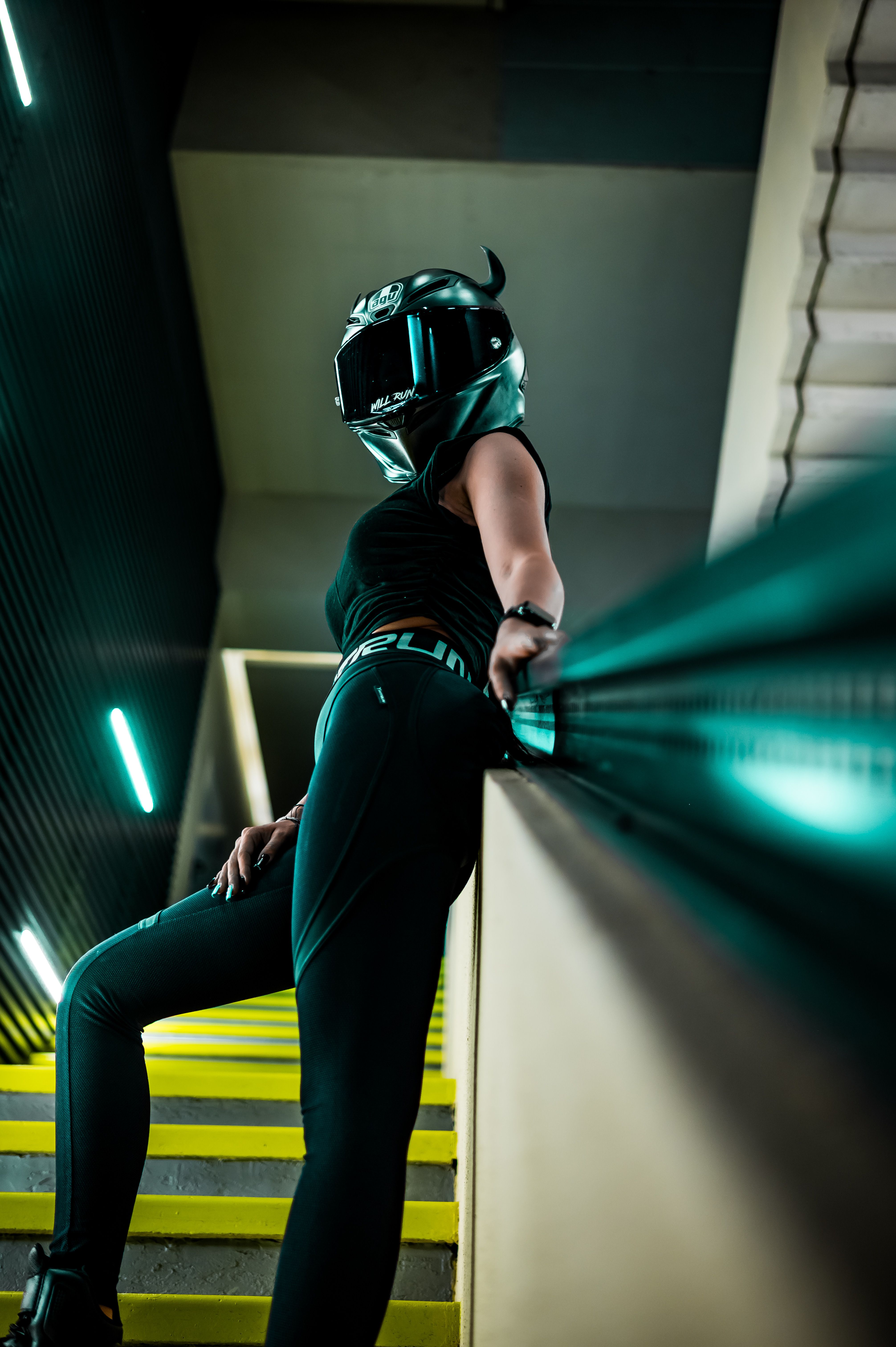 Stylish Biker in Helmet Posing Indoors · Free Stock Photo
