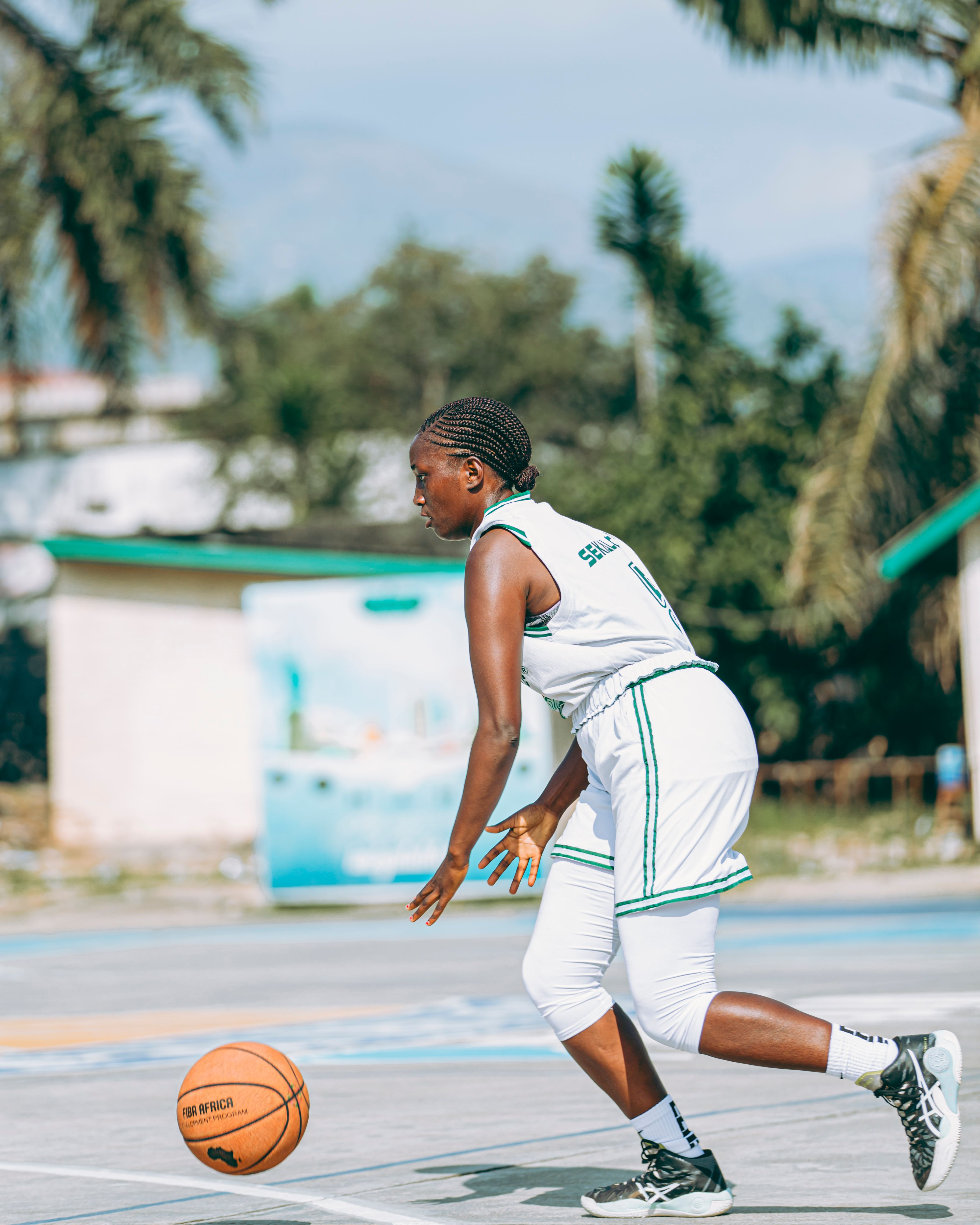 Female Basketball Player Dribbling Outdoors · Free Stock Photo